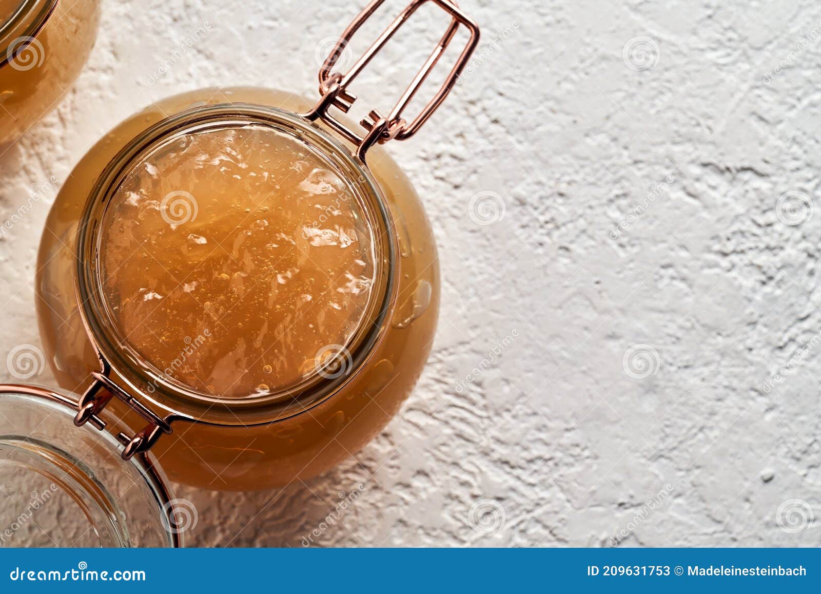 Chilled Congealed Beef Bone Broth in a Glass Jar - Top View with Copy ...