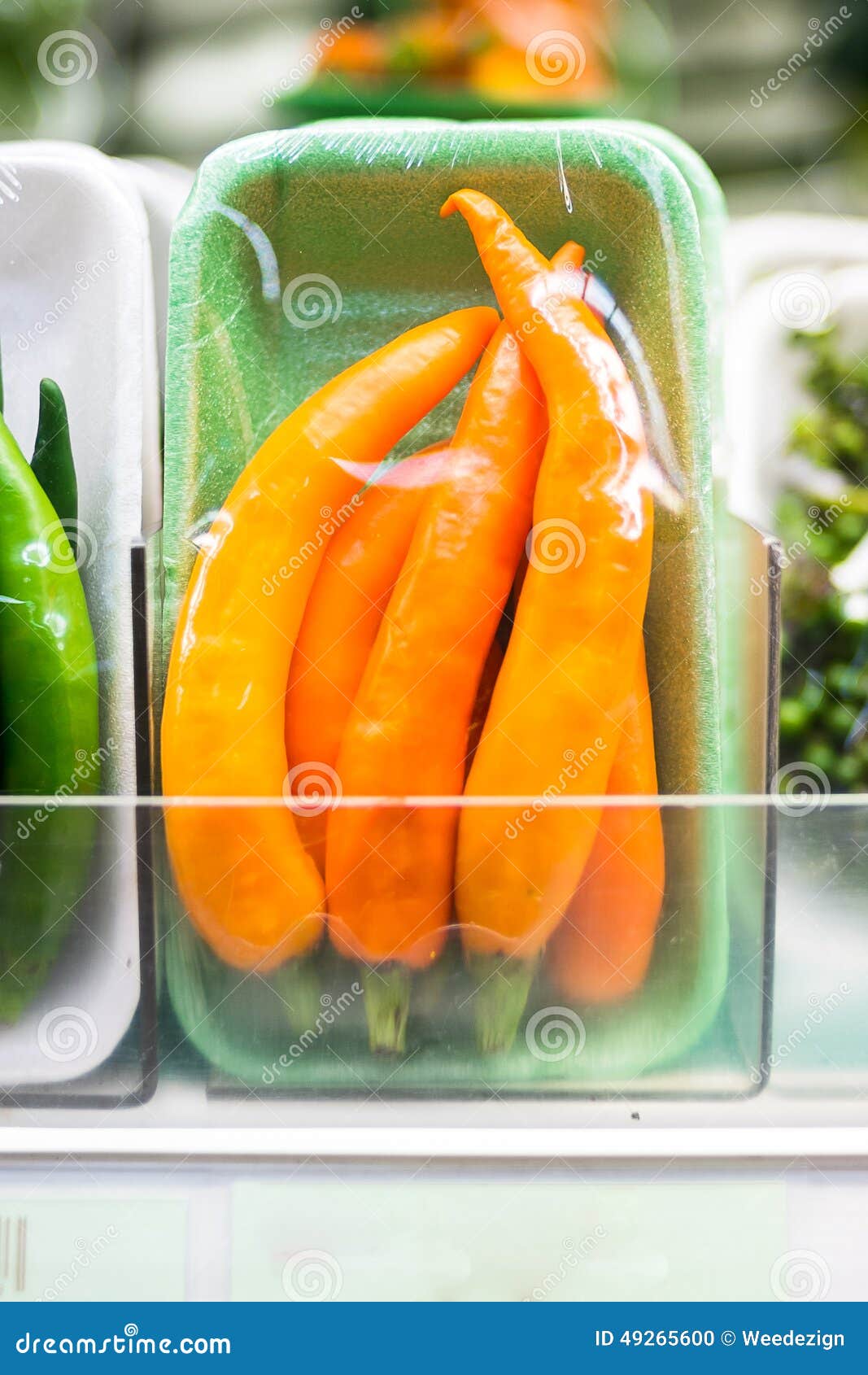 Chilli in Plastic Wrap at Supermarket Stock Photo - Image of fresh ...