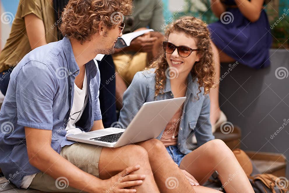 Chilling on Campus between Classes. a Shot of University Students ...