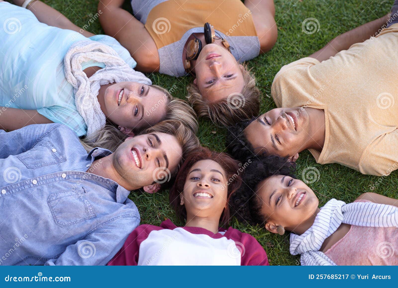 Chilling after Class. a Group of Young Students Lying on the Grass on ...