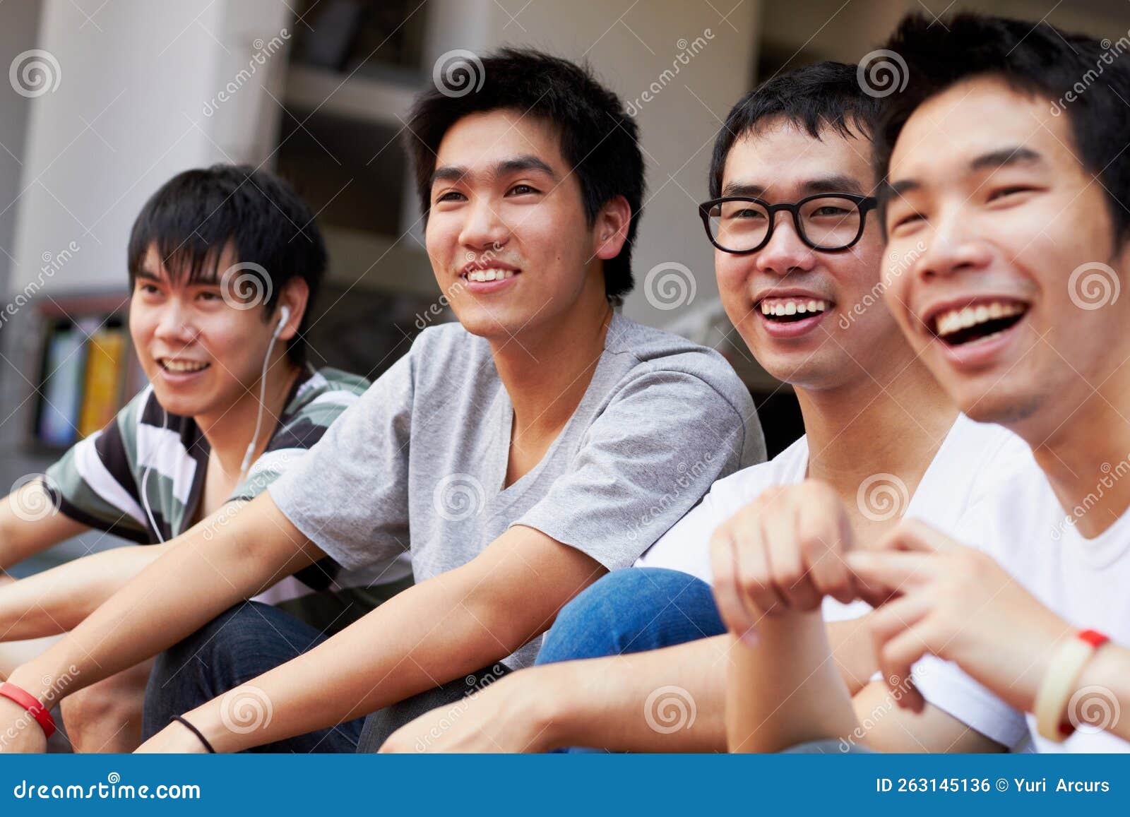 Chilling with the Guys. a Group of Asian Friends Sitting Outdoors ...