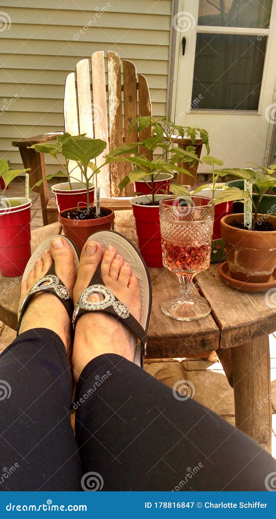 Chilling on the patio stock image. Image of feet, home - 178816847