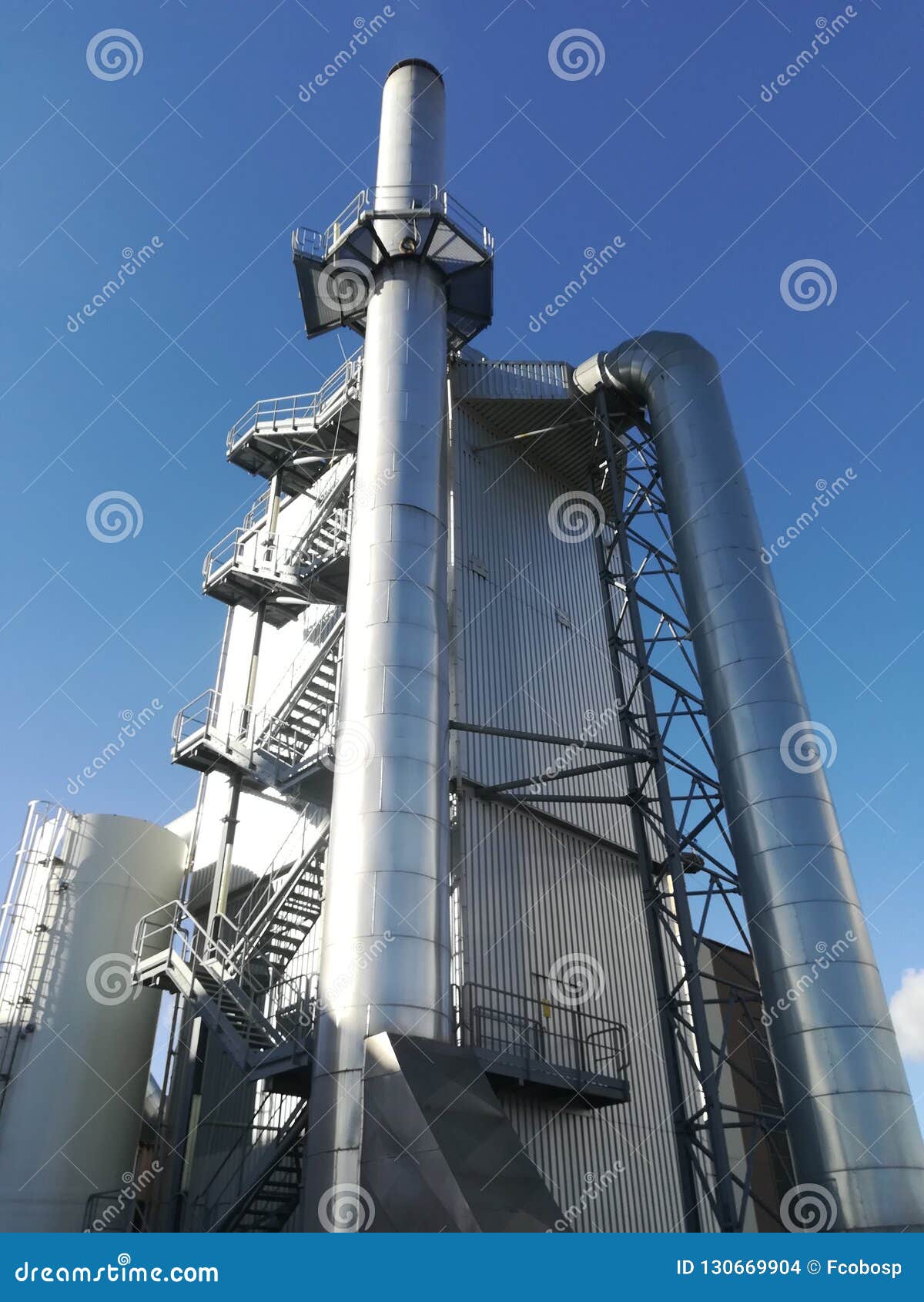 Chimney of a large factory stock photo. Image of distillery - 130669904