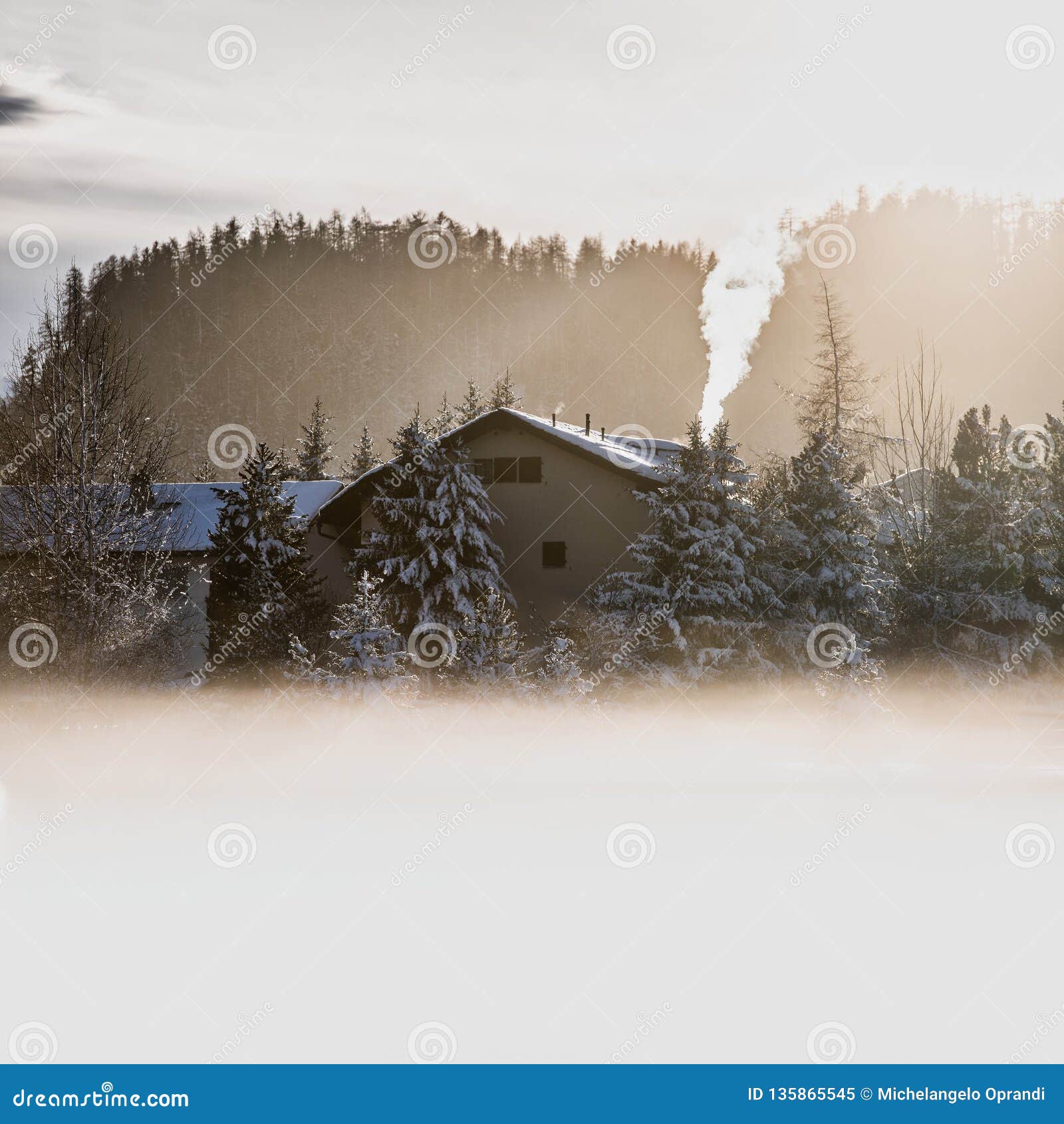 Chimney Smoke of a House in the Cold Mist in the High Mountains Stock ...