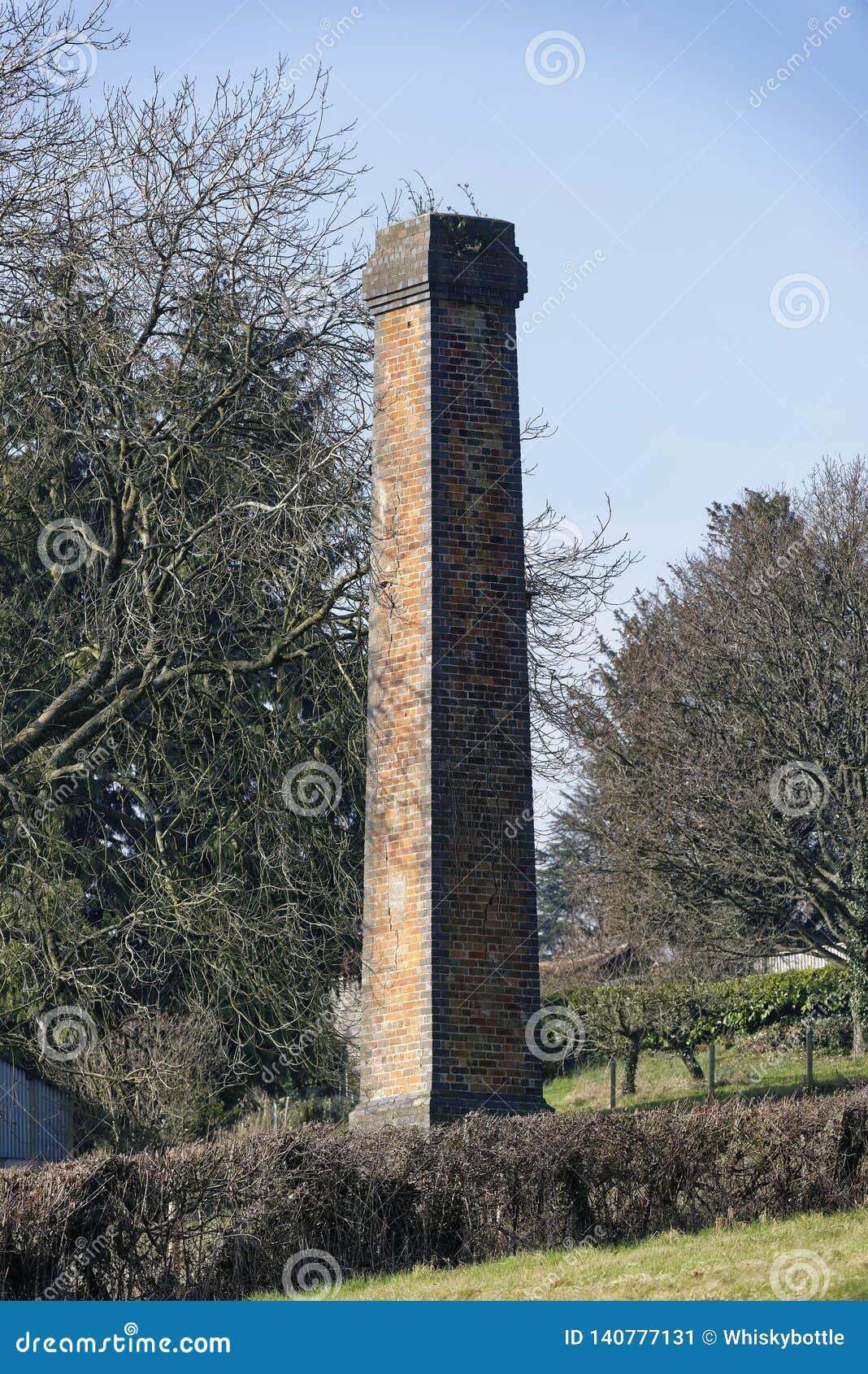 Chimney Stack in Field stock image. Image of hill, portrait - 140777131