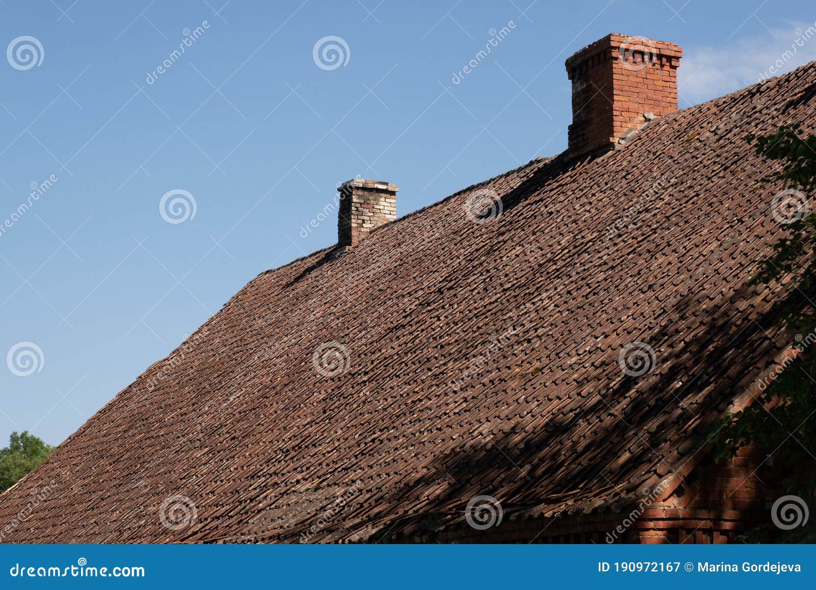 Chimney Stacks on Tile Roof of Ancient Style Property. Old Brown Tile ...