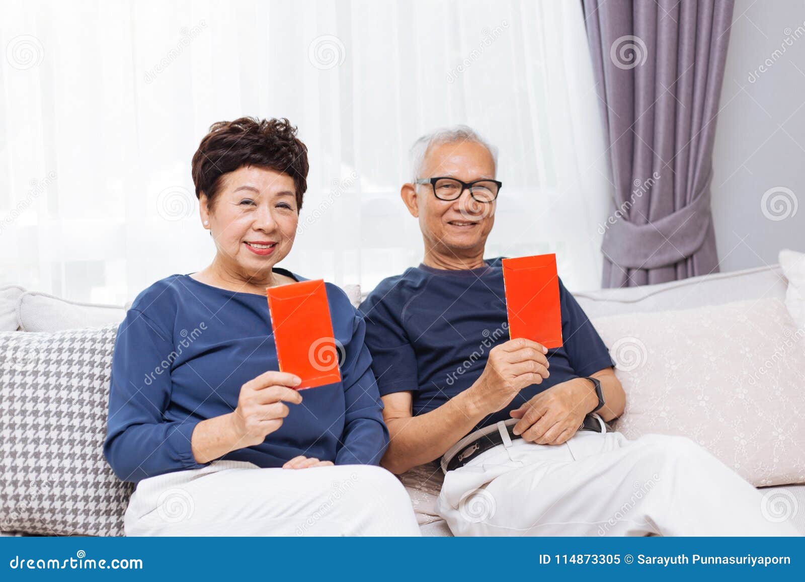 Chinese Asian Senior Elders Giving Red Envelope or Hong Bao To Younger ... Chinese Asian Senior Elders Giving Red Envelope or Hong Bao To Younger ...