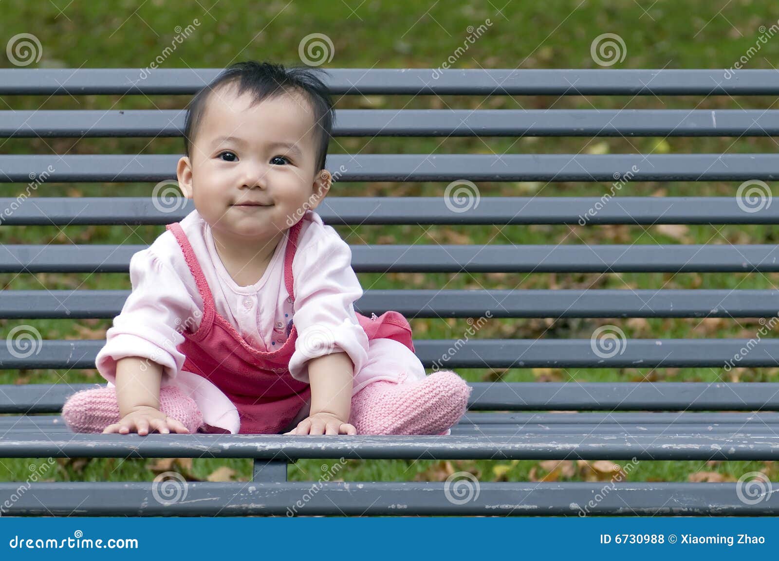 Chinese baby on the bench stock photo. Image of female - 6730988