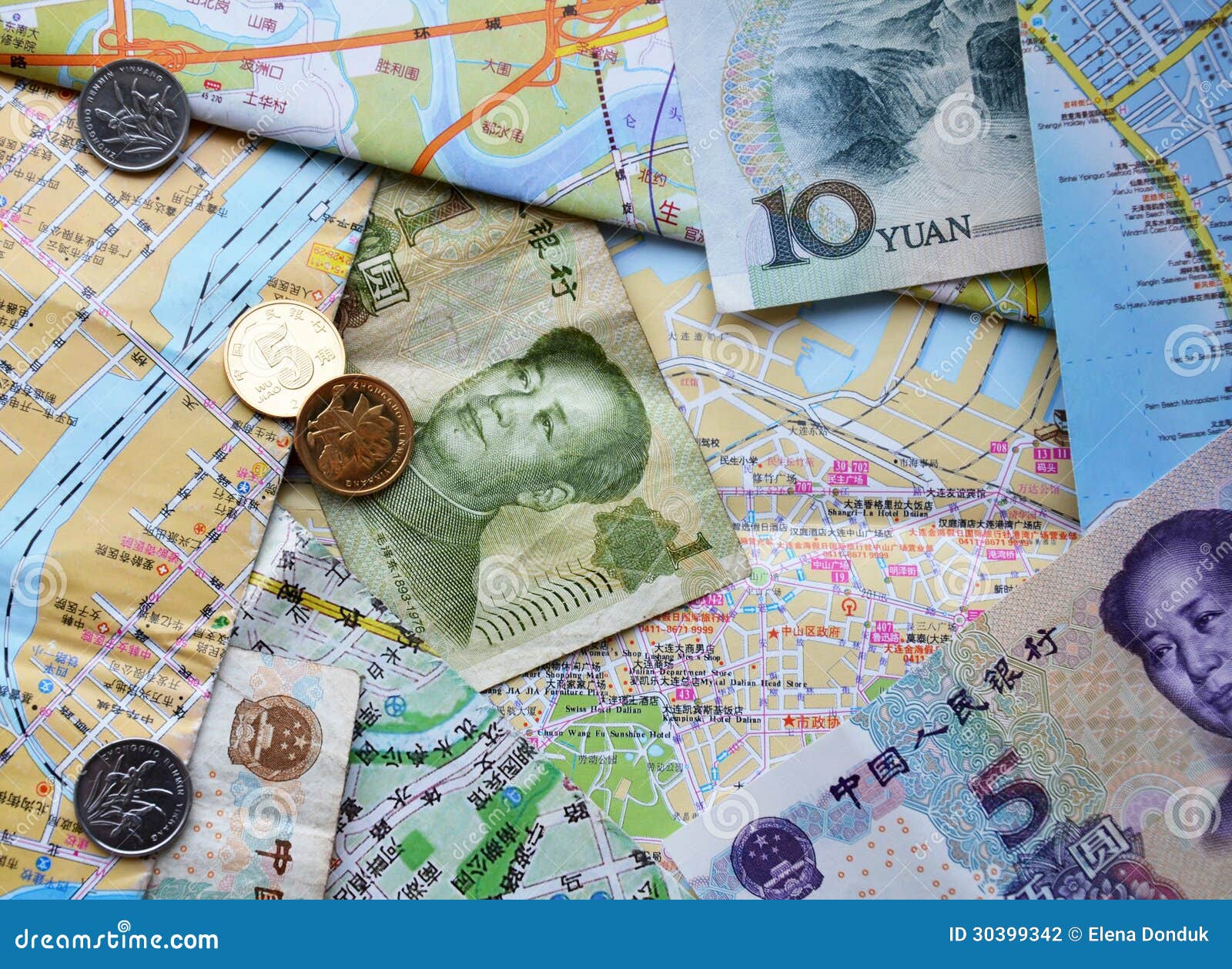 Chinese Bank Notes and Coins on a Chinese Maps Stock Photo - Image of ...