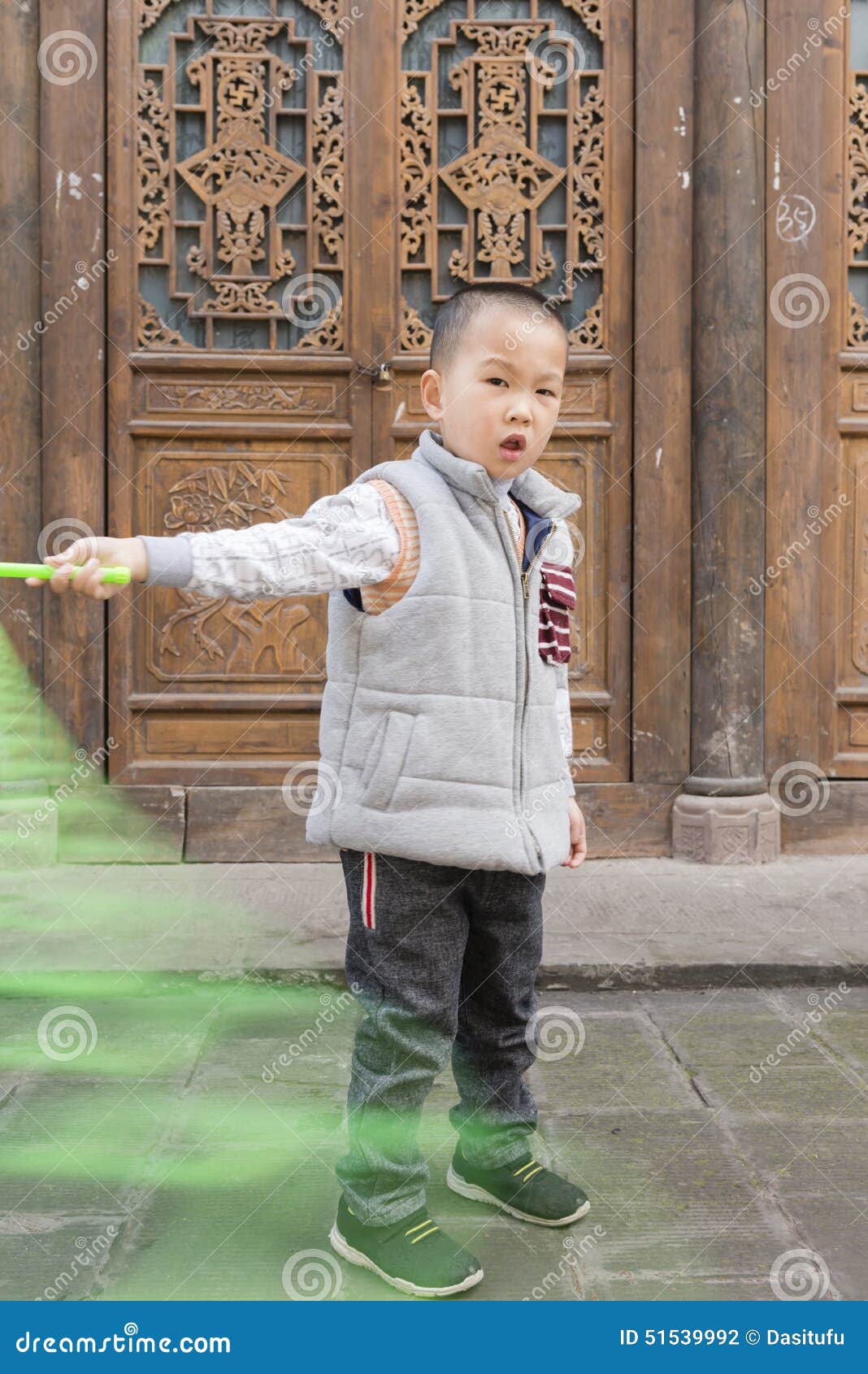 Chinese boy playing toy stock photo. Image of childhood - 51539992