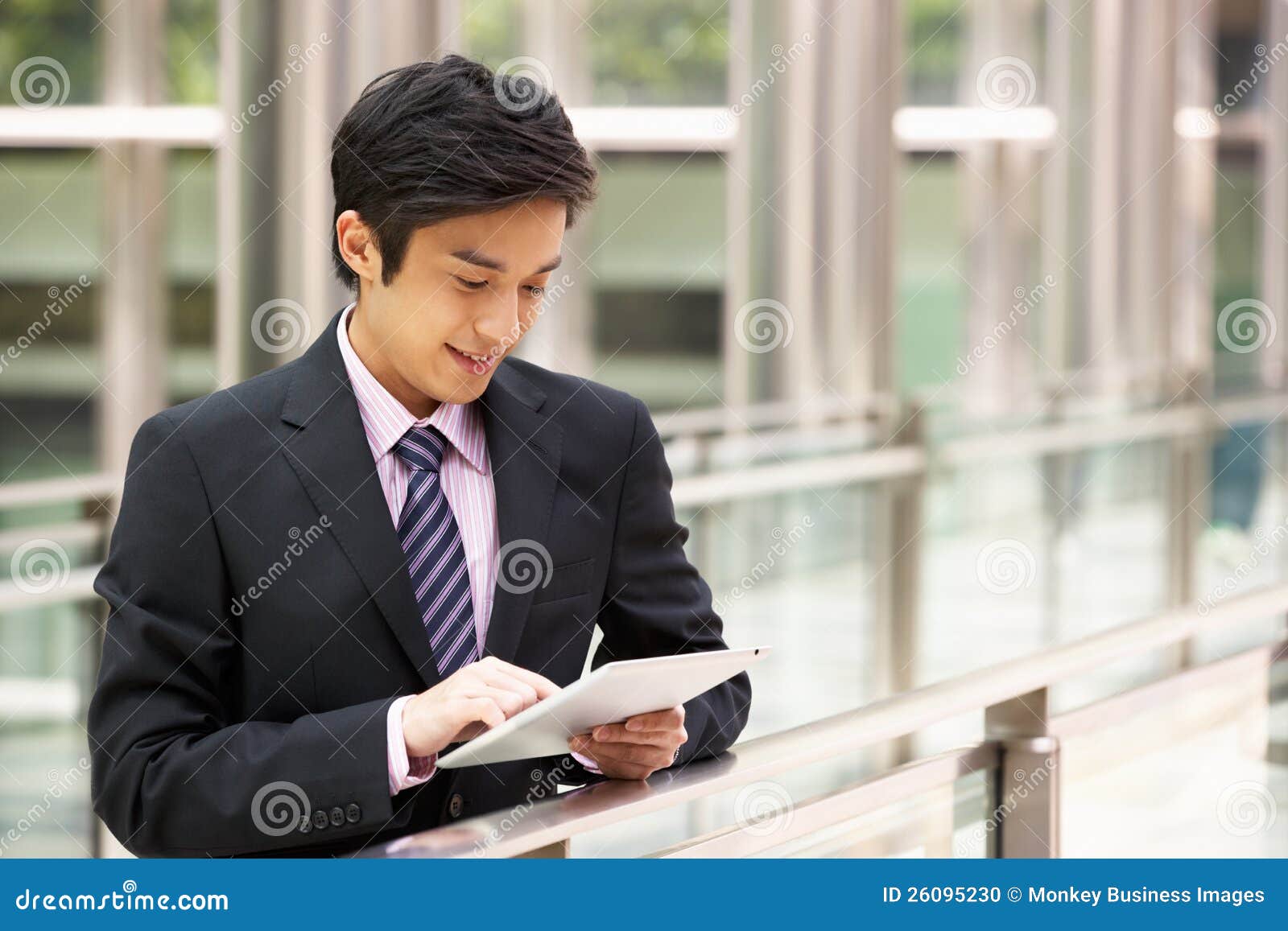 Chinese Businessman Working on Tablet Computer Stock Photo - Image of ...
