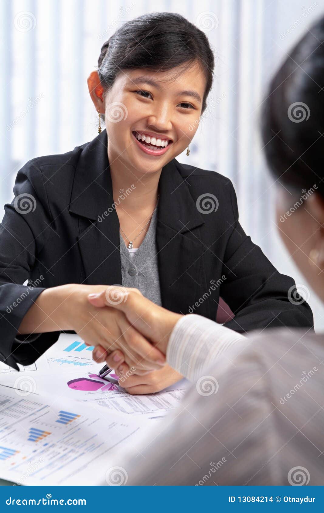 Chinese Busineswoman Handshake with Her Client Stock Photo - Image of ...