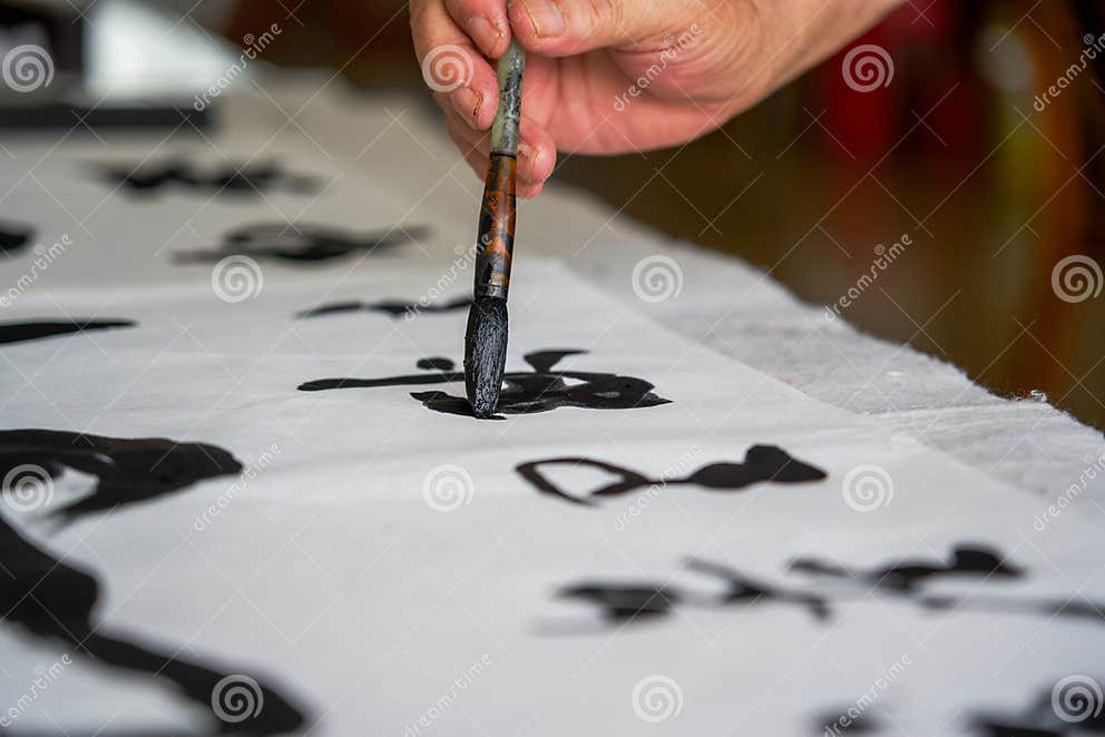 A Chinese Calligrapher Writes Calligraphy and Creates a Calligraphy ...