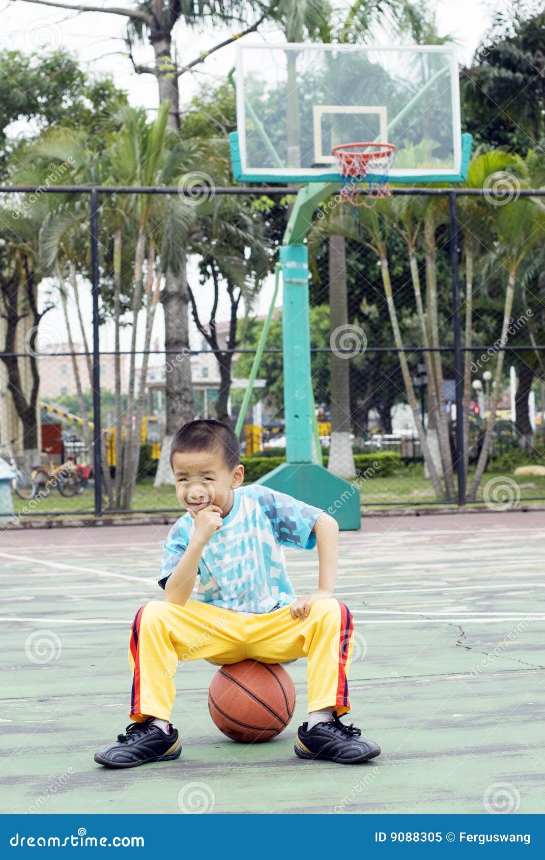 A Chinese Child with a Basketball Stock Image - Image of siblings ...