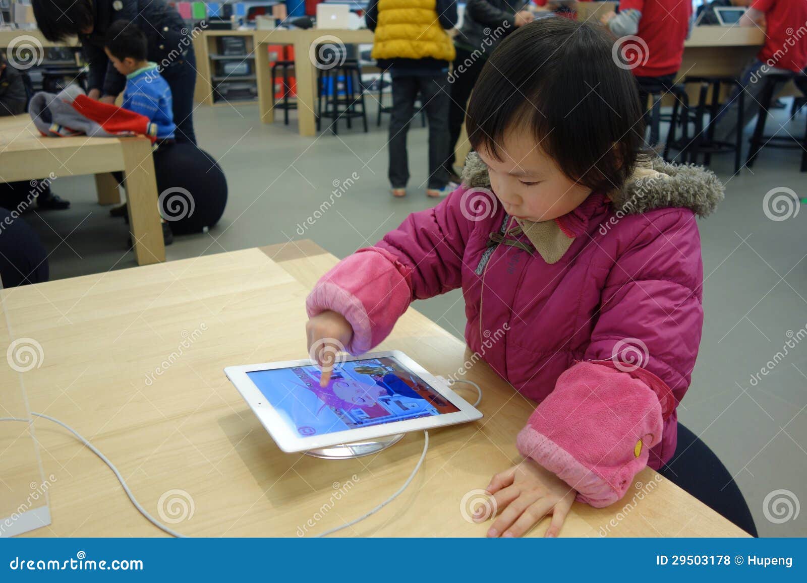 Chinese child playing ipad editorial stock photo. Image of education ...