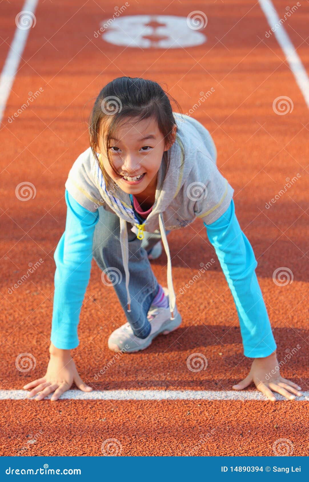Chinese Child Prepares To Start Running Stock Photo - Image of hair ...