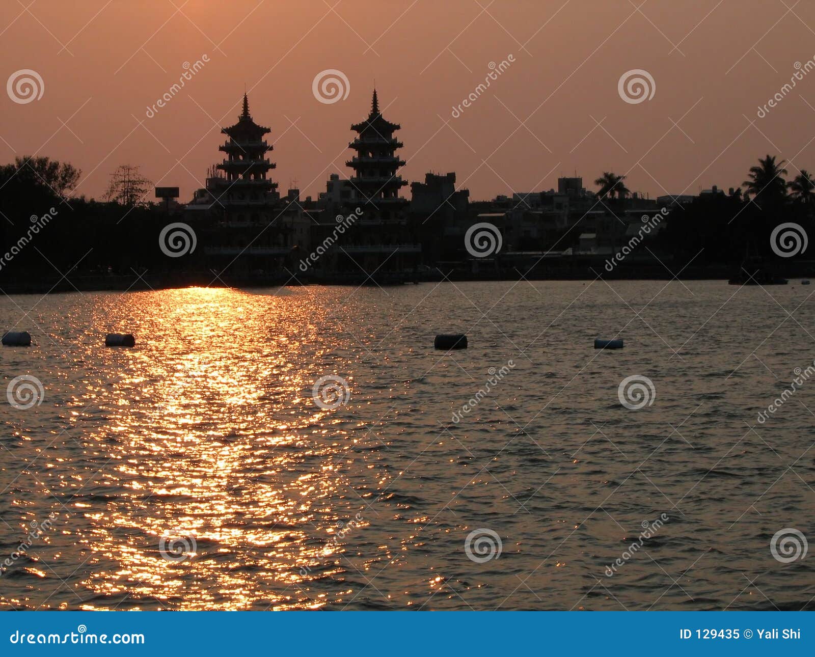 Chinese City at Sunset stock image. Image of reflection - 129435