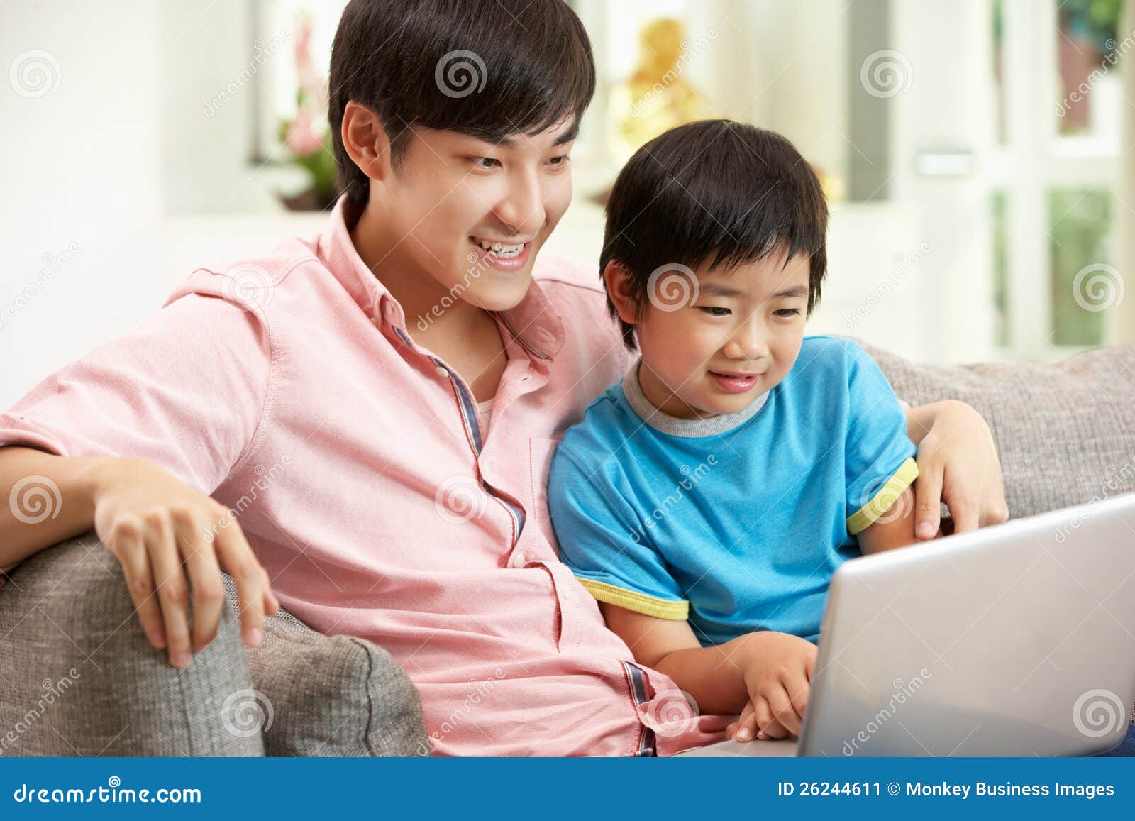 Chinese Father And Son Using Laptop Royalty-Free Stock Image ...