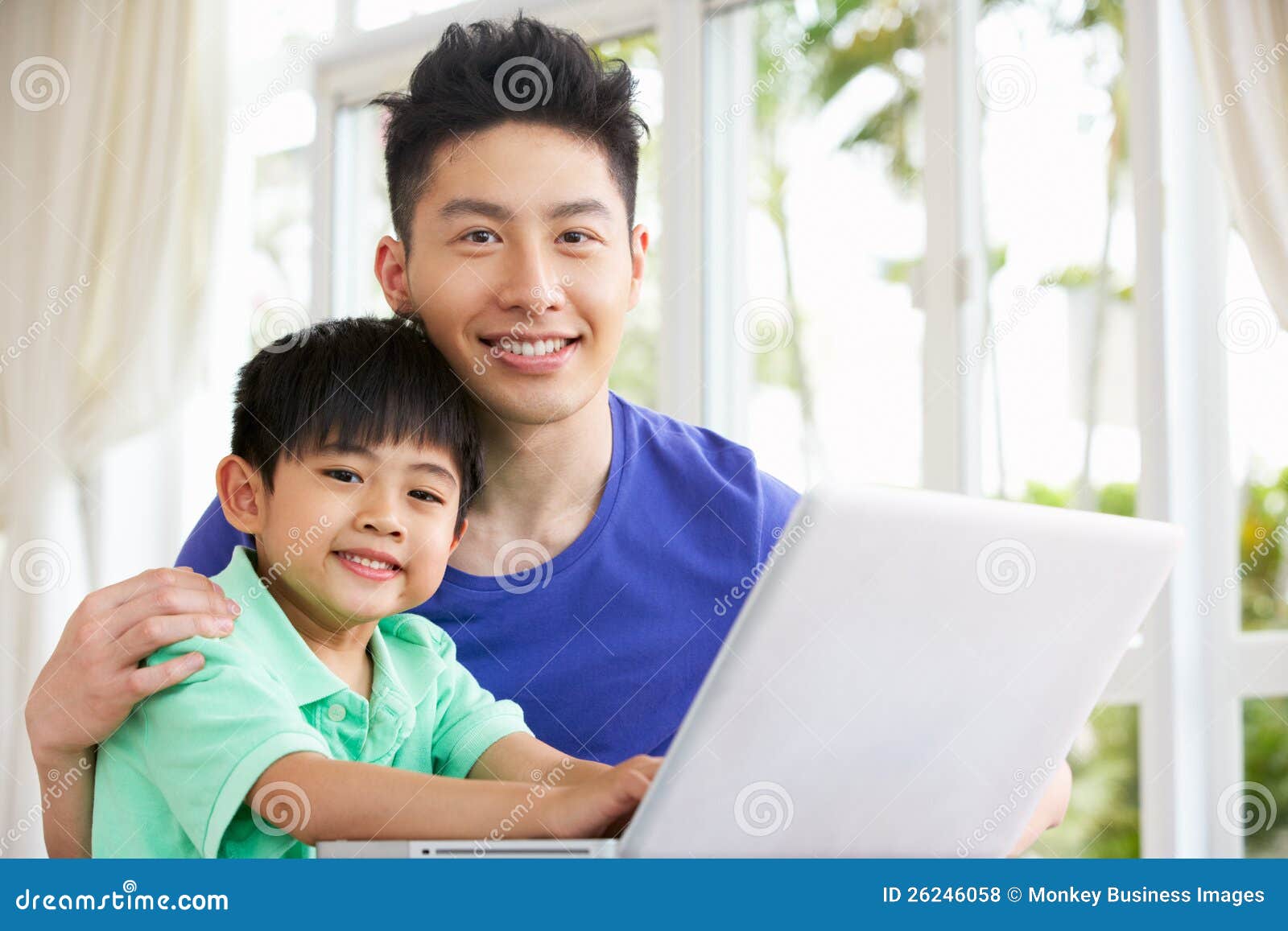 Chinese Father And Son Using Laptop Royalty-Free Stock Image ...