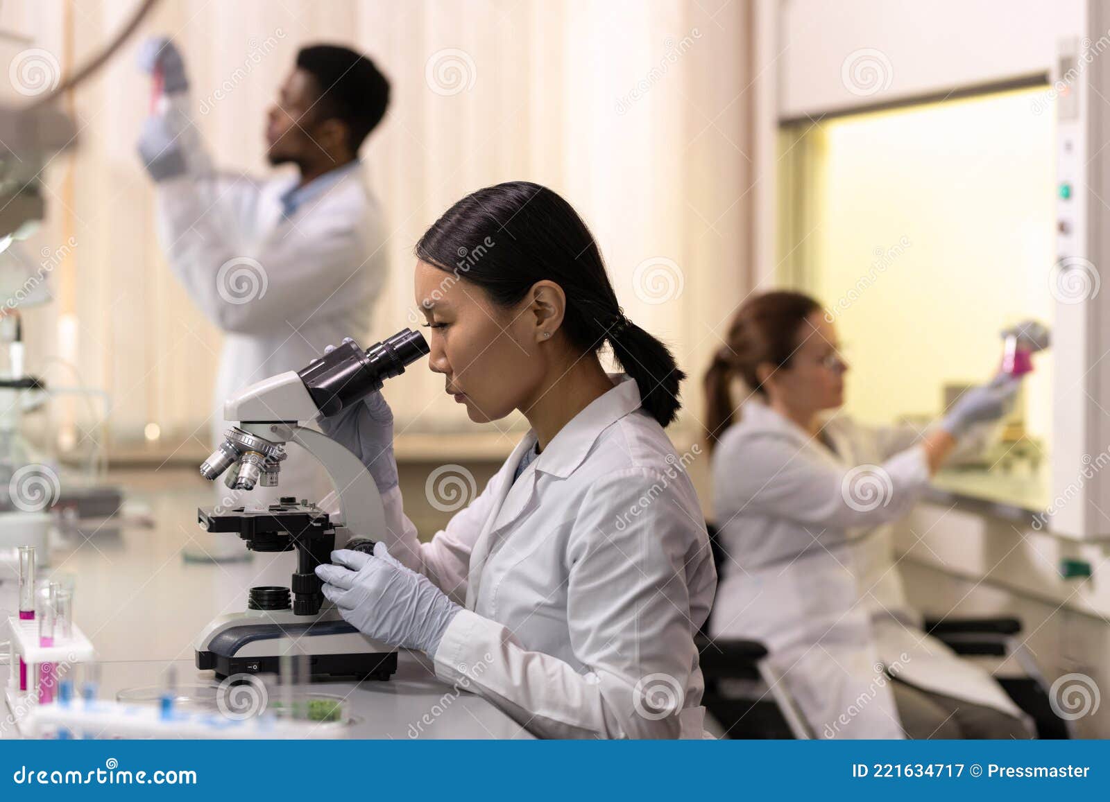 Chinese Female Scientist Looking in Microscope Stock Image - Image of ...