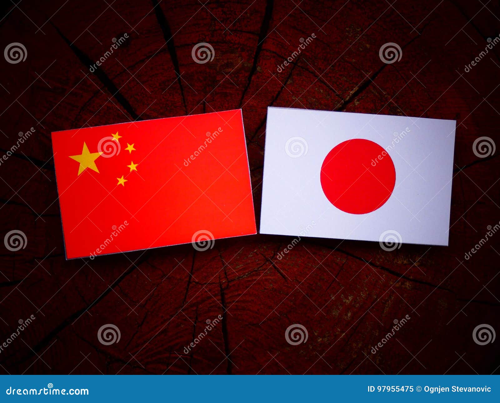 Chinese Flag with Japanese Flag on a Tree Stump Isolated Stock Image ...