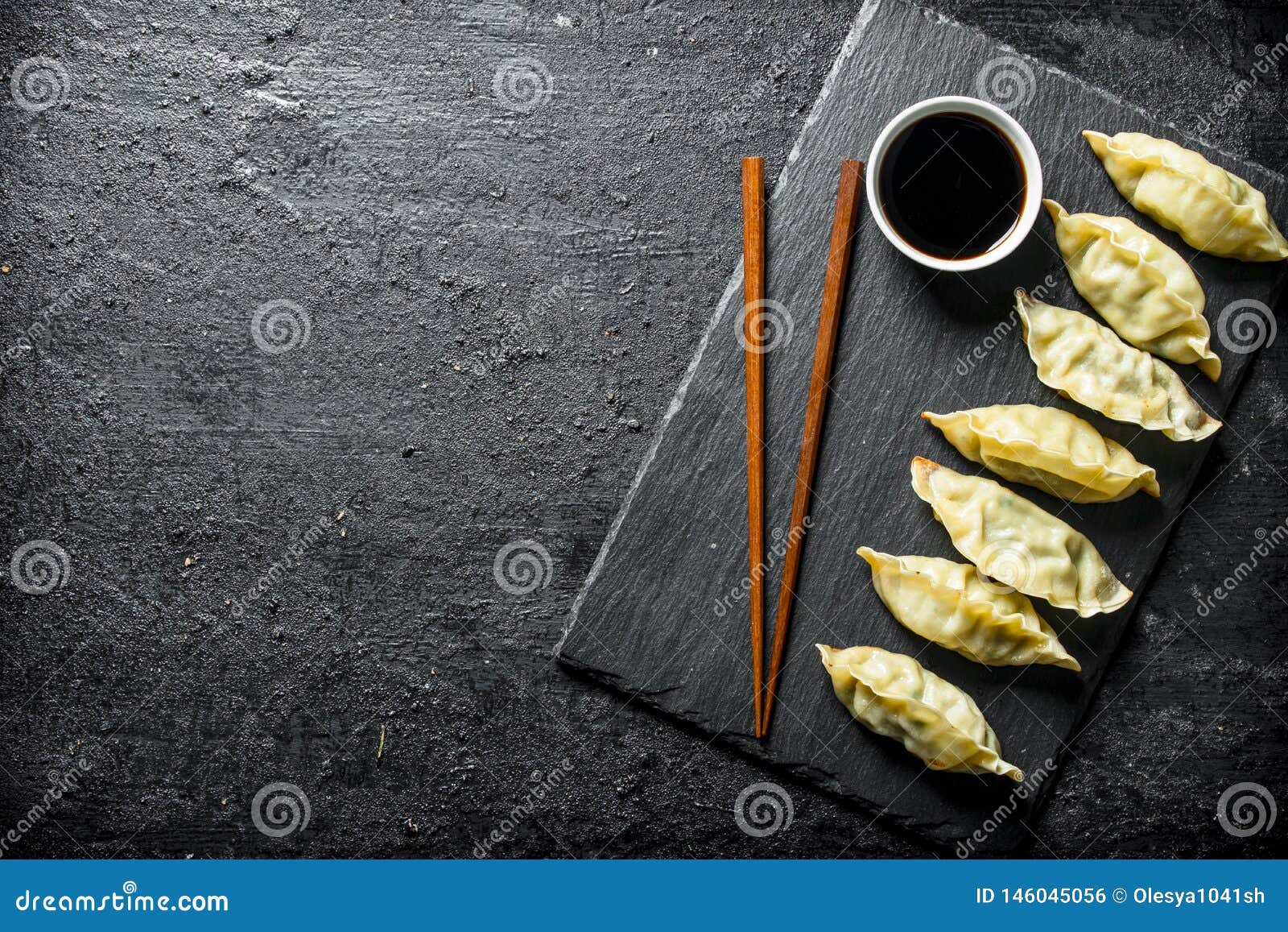Chinese Gedza Dumplings on a Black Stone Board Stock Photo - Image of ...