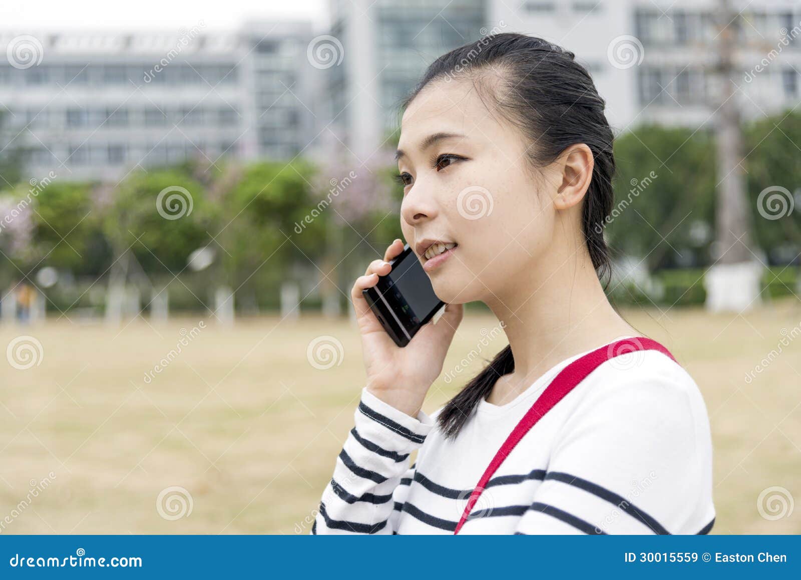 The girl is on the phone stock image. Image of asians - 30015559
