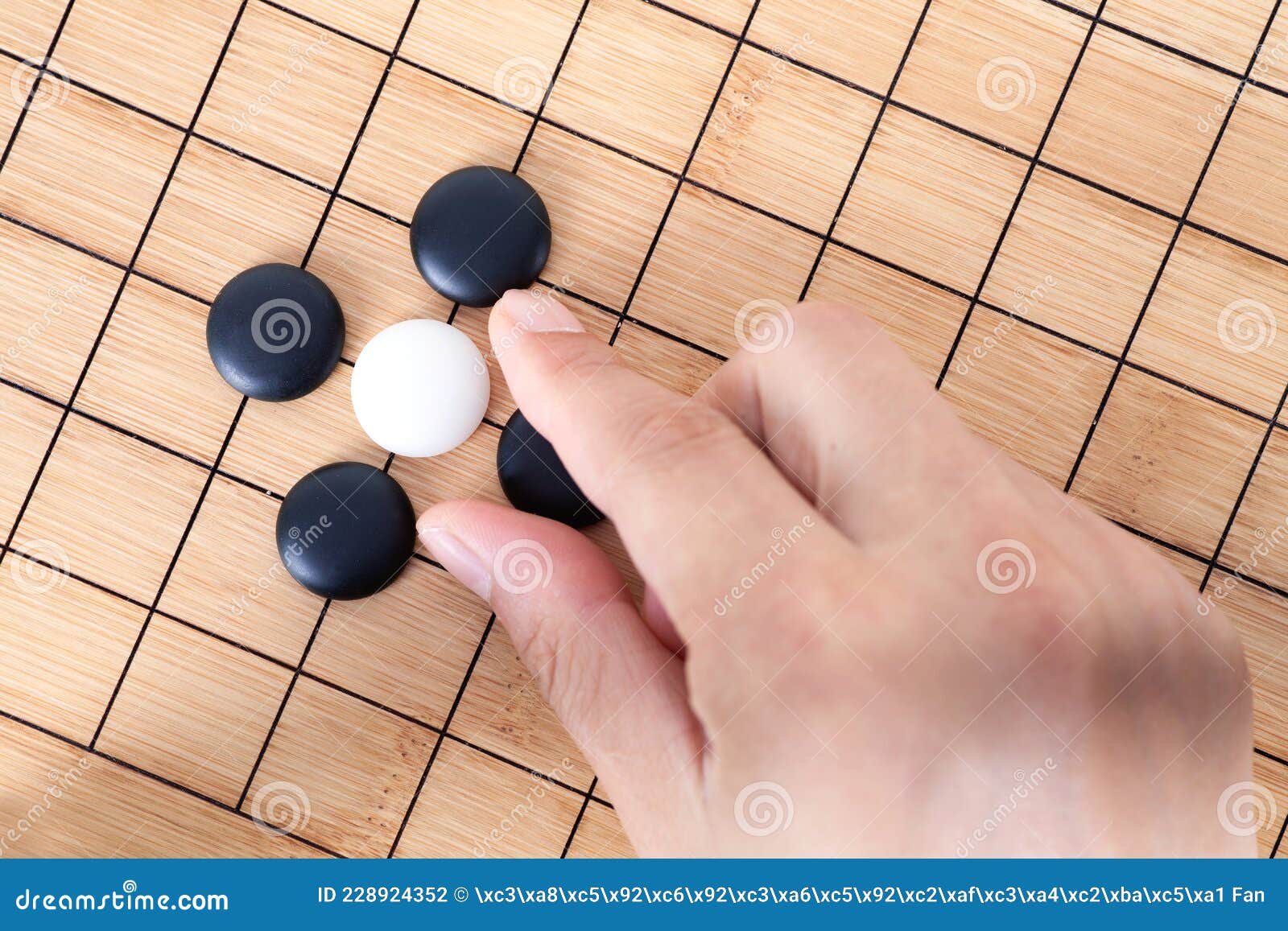 Chinese Go Game on table stock photo. Image of intelligence - 228924352
