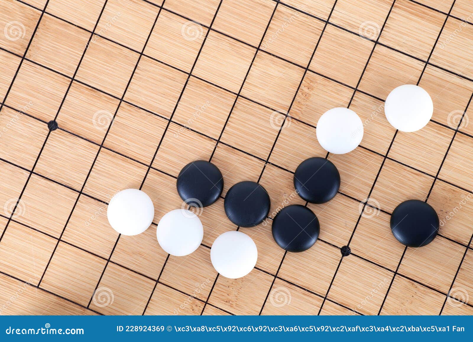 Chinese Go Game on table stock image. Image of leisure - 228924369