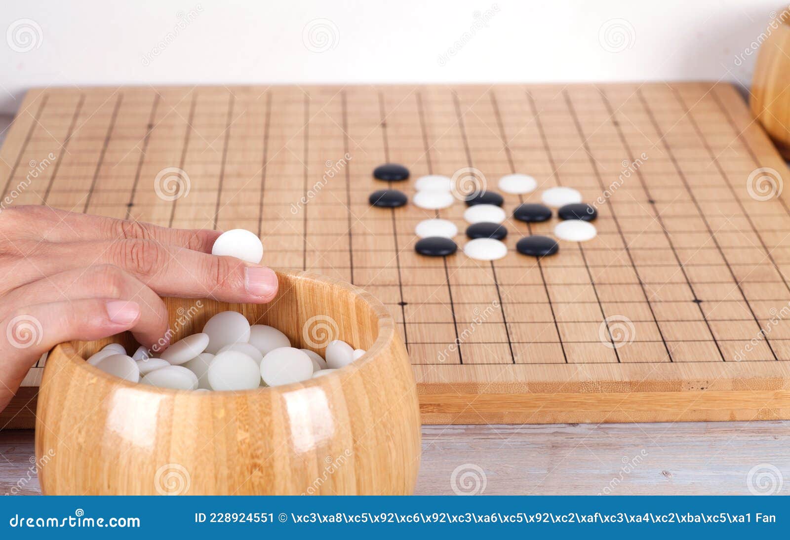 Chinese Go Game on table stock image. Image of chessboard - 228924551