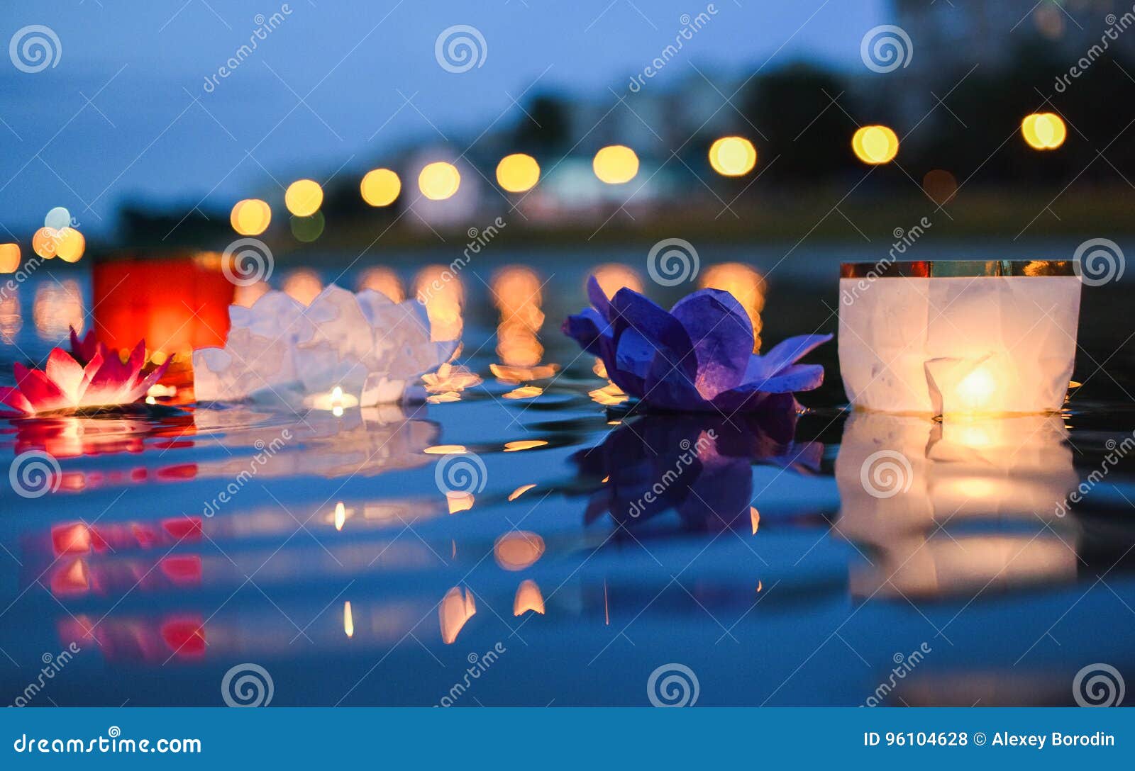 Chinese Lanterns Floating in River at Night with City Lights Stock ...