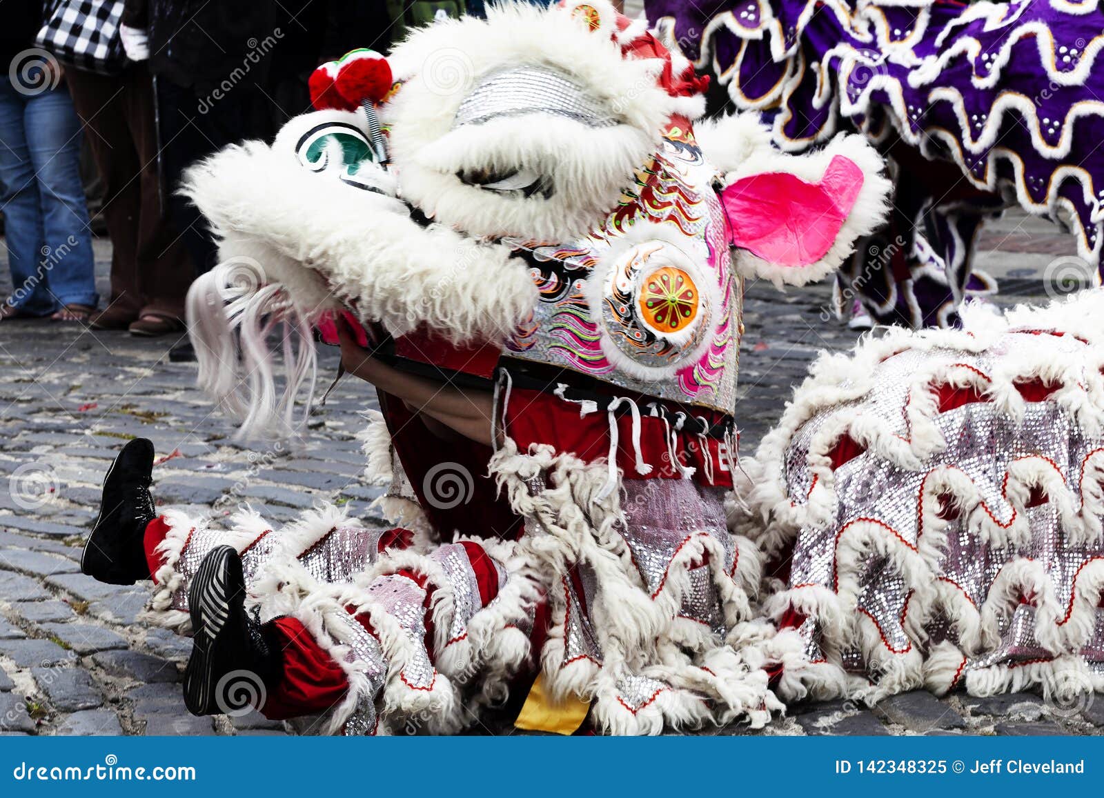 Chinese Lion Dancer Sitting on Ground Performing for Crowd Stock Image ...