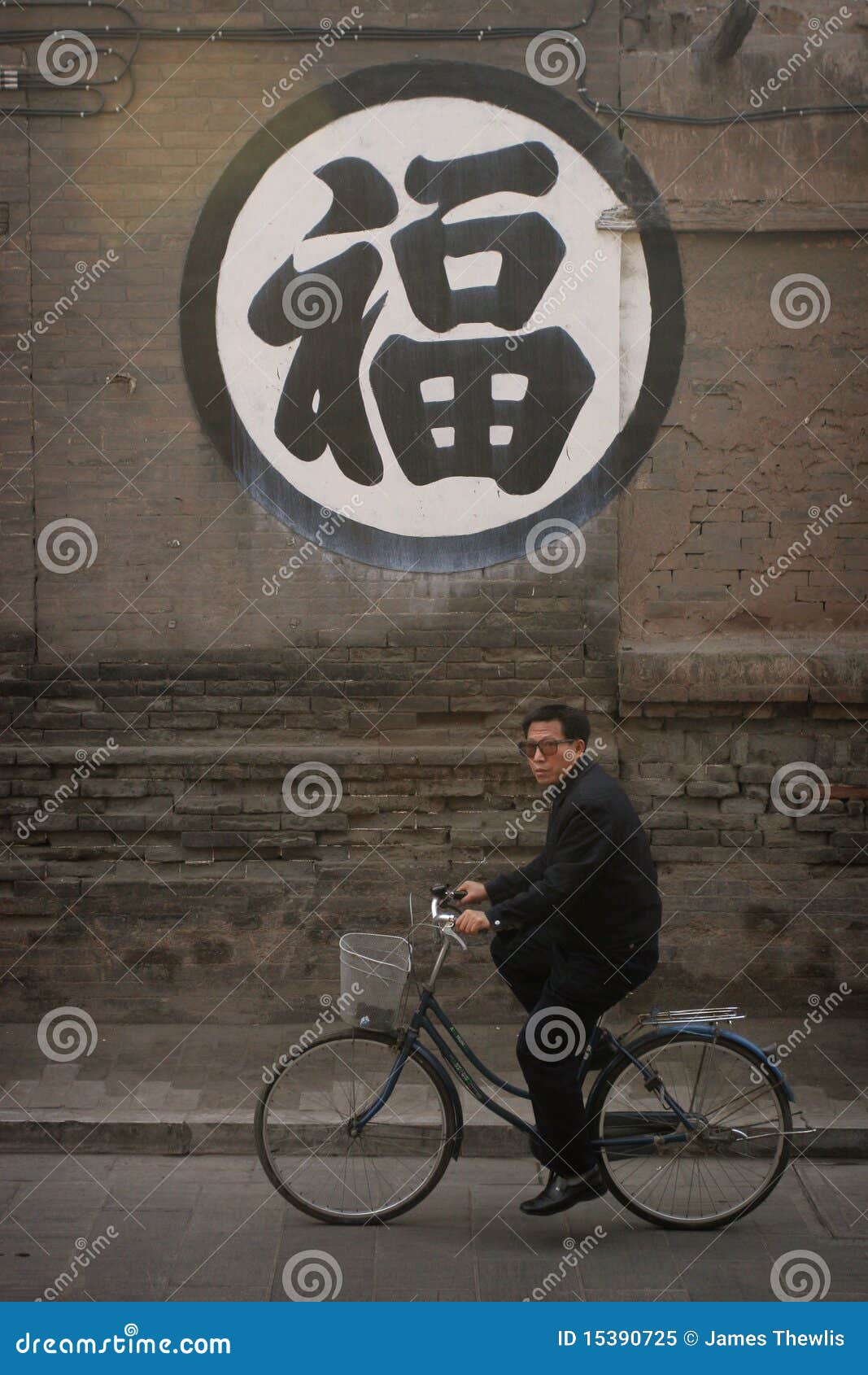 Chinese man riding a bike editorial image. Image of wall - 15390725