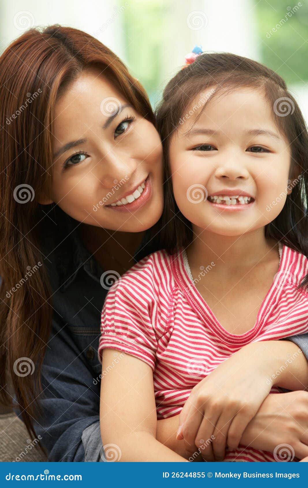 Chinese Mother and Daughter Sitting on Sofa Stock Image - Image of ...
