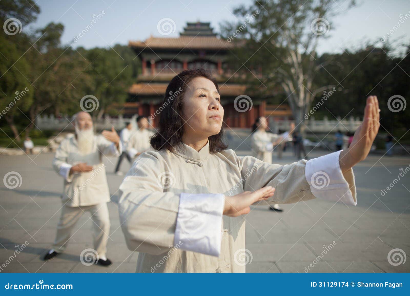 Chinese People Practicing Tai Ji in Front of Traditional Chinese ...