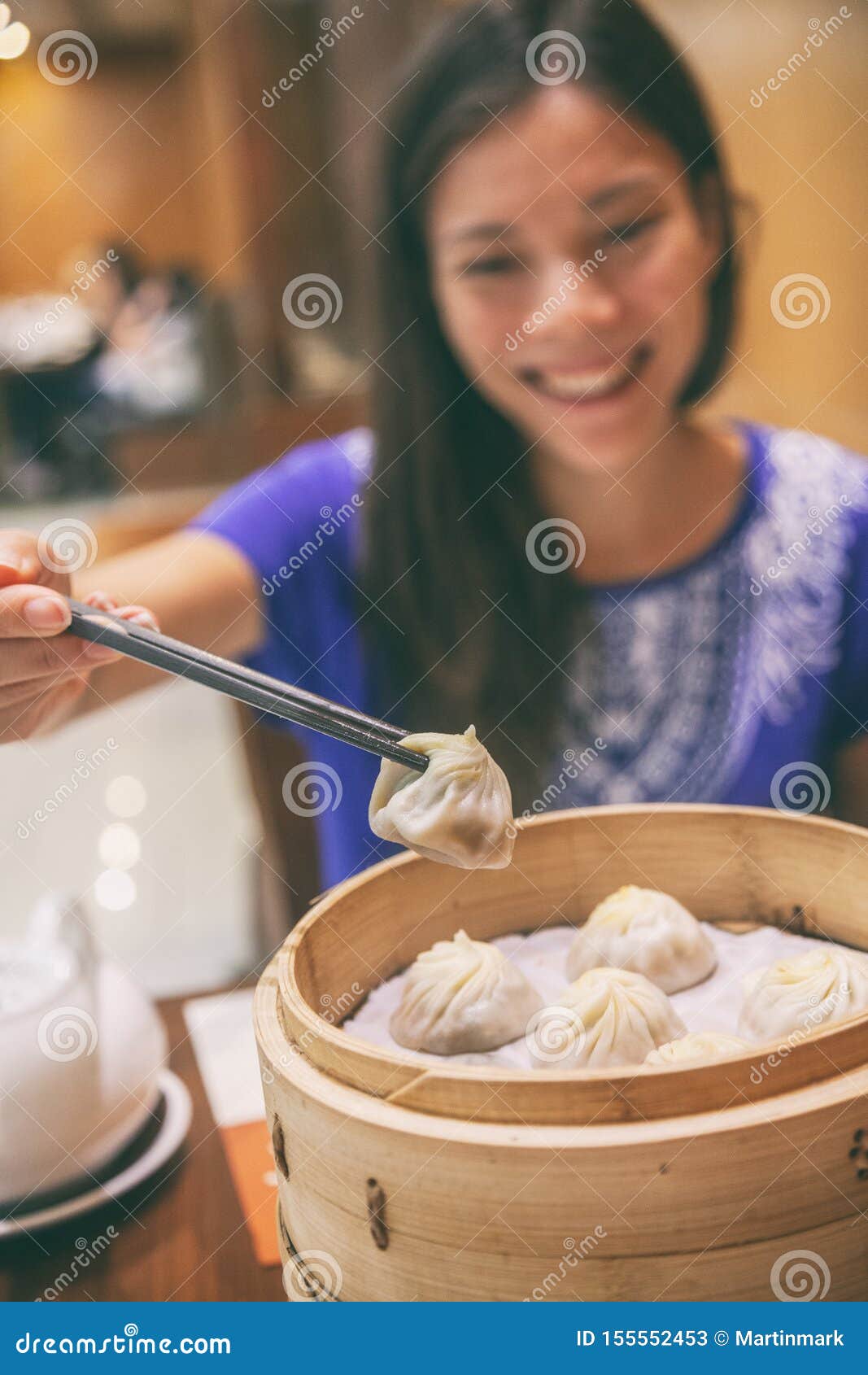 Chinese Restaurant Asian Woman Eating Xiao Long Bao Dumplings Steamed