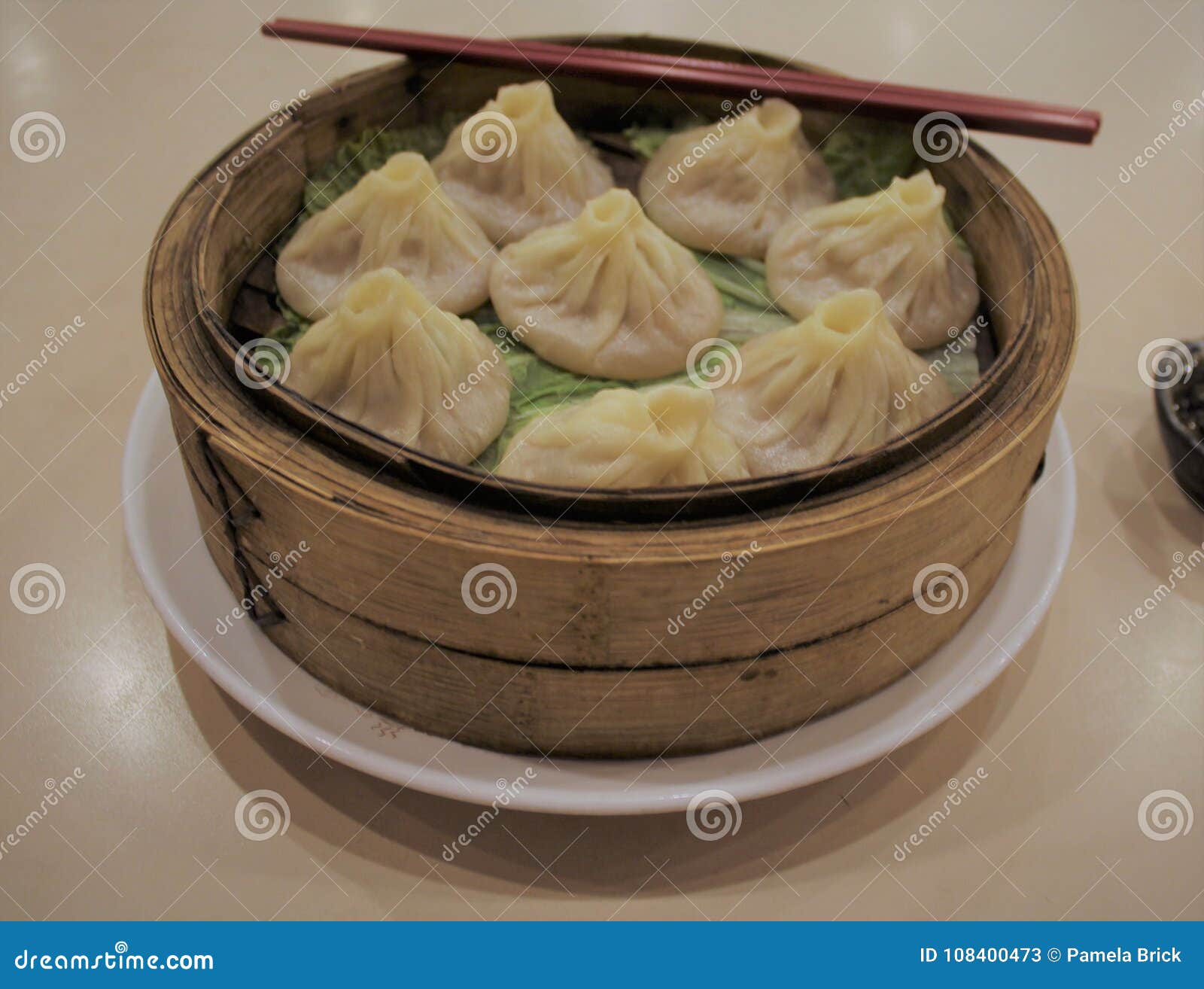 Chinese Shanghai Soup Dumplings Xiaolongbao Sit In A Steamer Stock