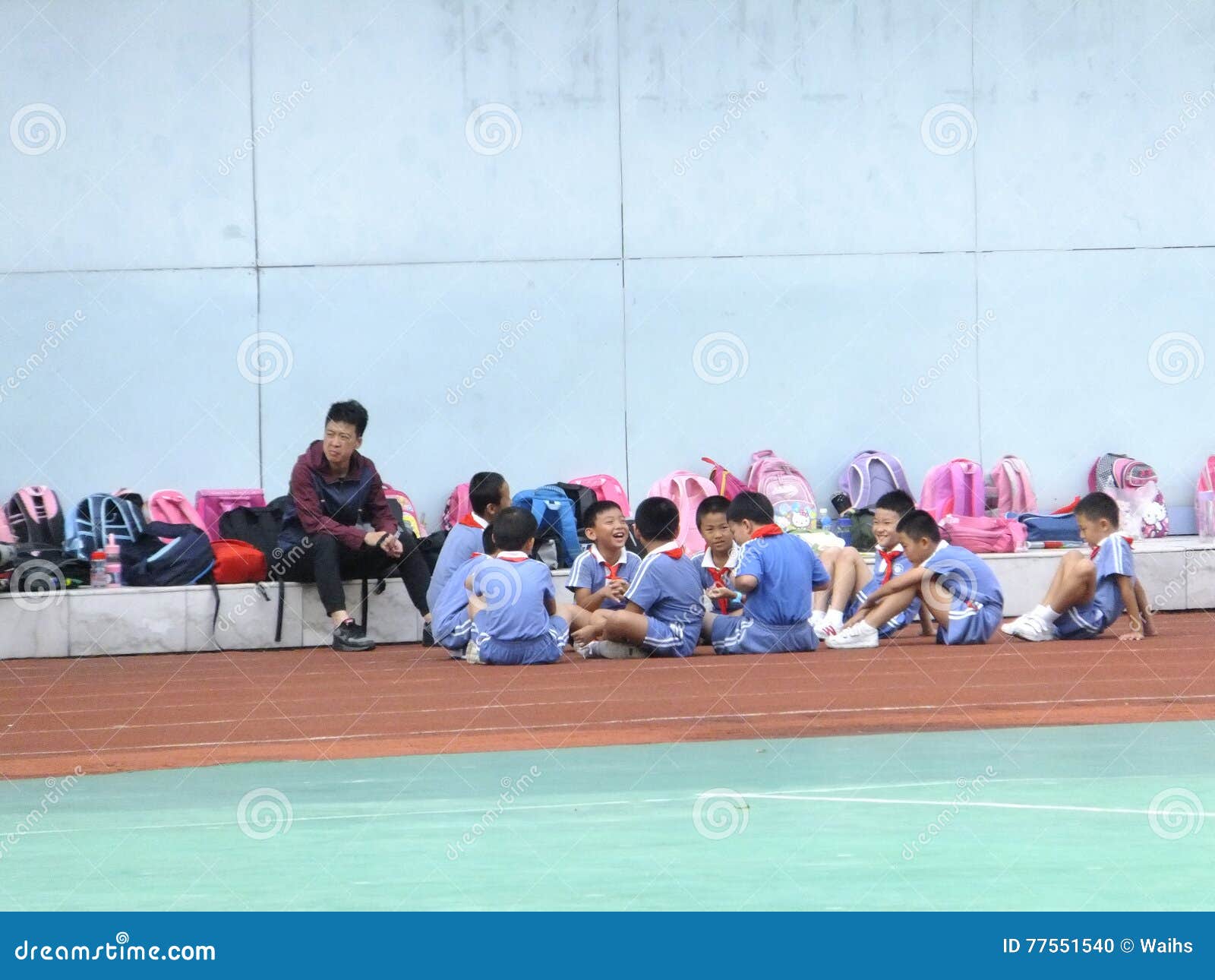 Chinese Students are Sitting on the Ground, in the Physical Education ...