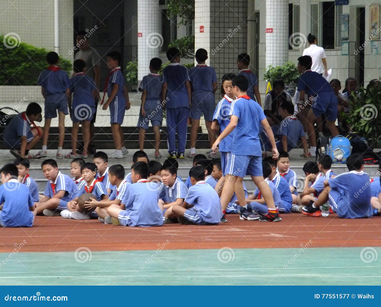 Chinese Students are Sitting on the Ground, in the Physical Education ...