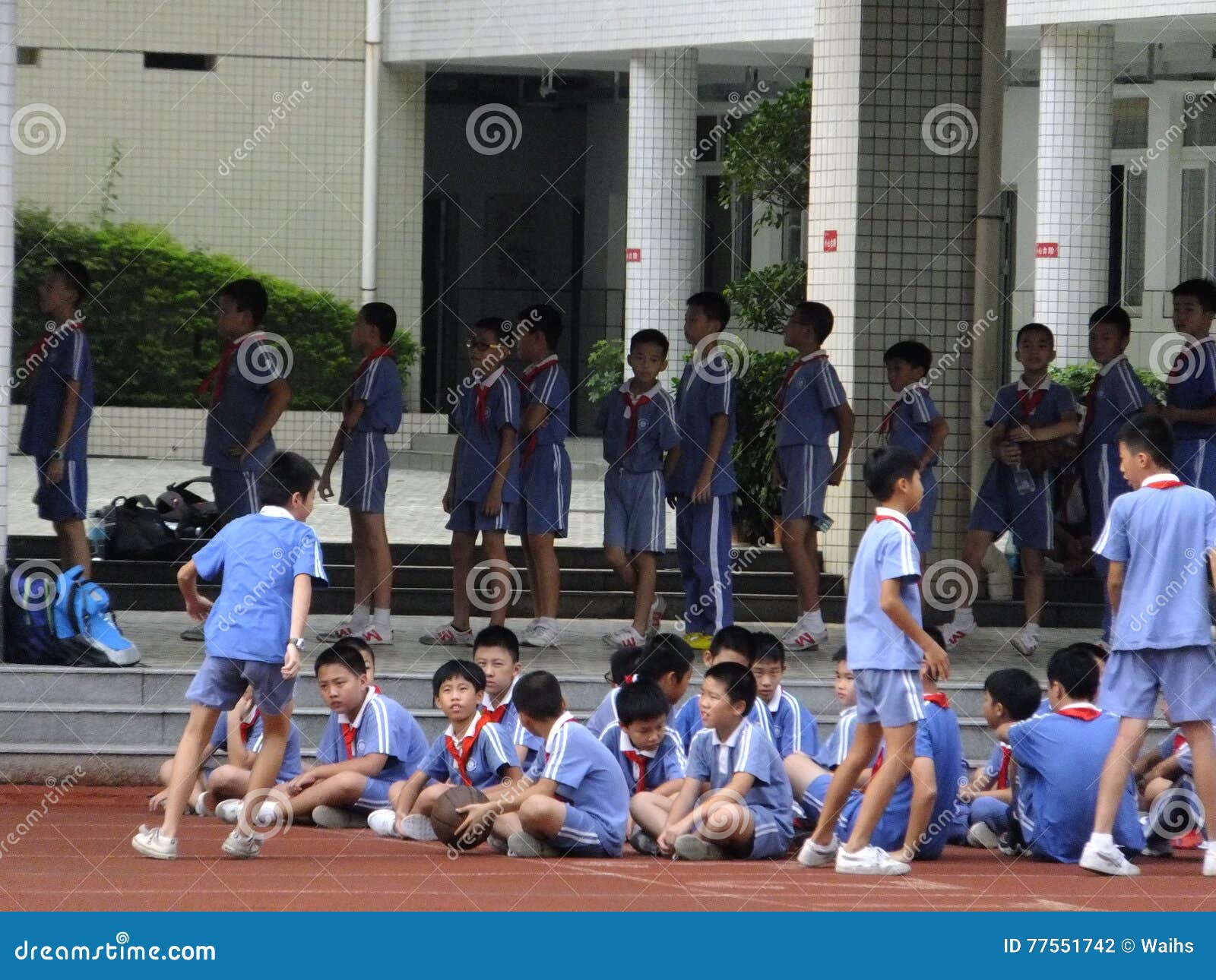 Chinese Students are Sitting on the Ground, in the Physical Education ...
