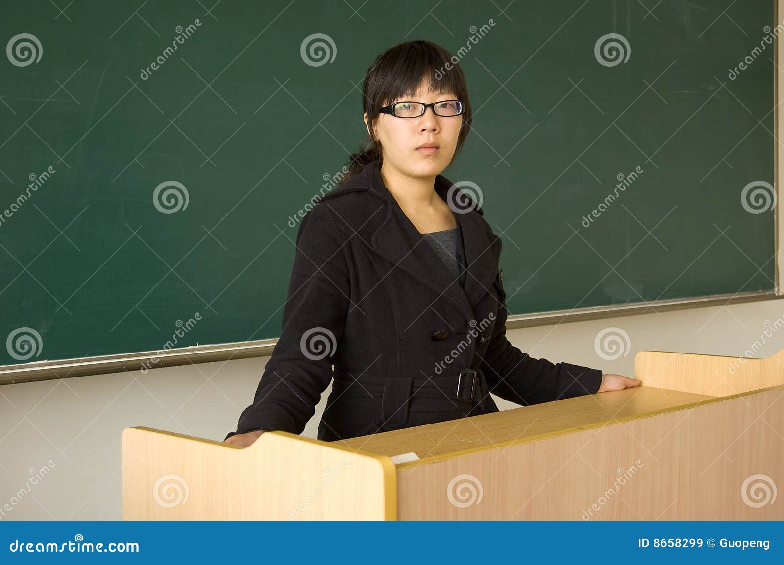Chinese Teacher stock image. Image of desks, women, young - 8658299