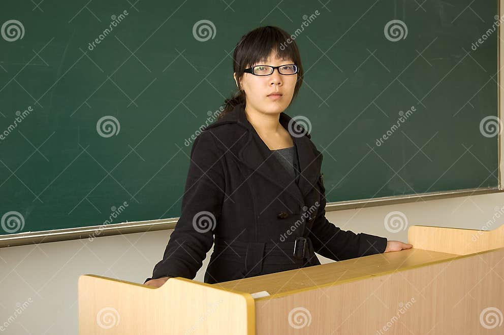 Chinese Teacher stock image. Image of desks, women, young - 8658299