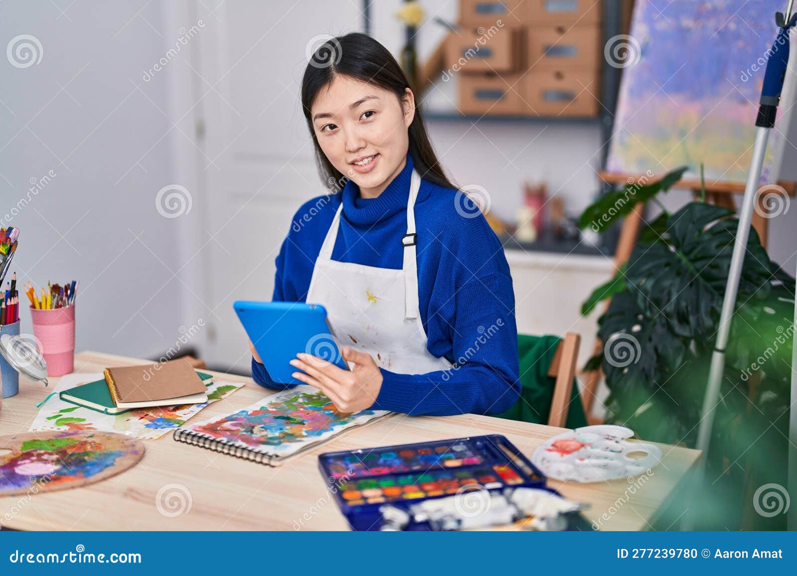 Chinese Woman Artist Using Touchpad Drawing on Notebook at Art Studio ...
