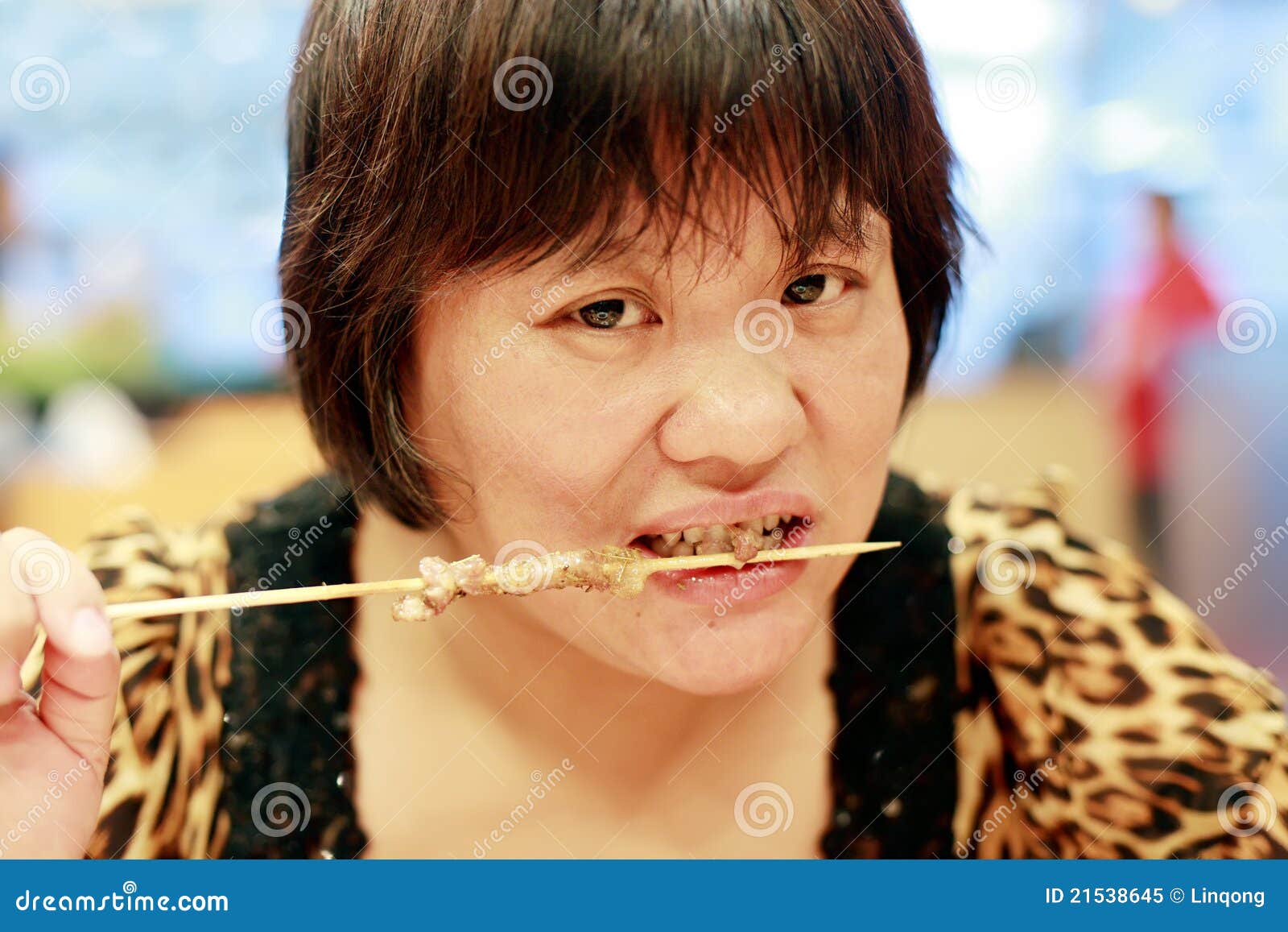 Chinese woman eating kebab stock image. Image of dessert - 21538645