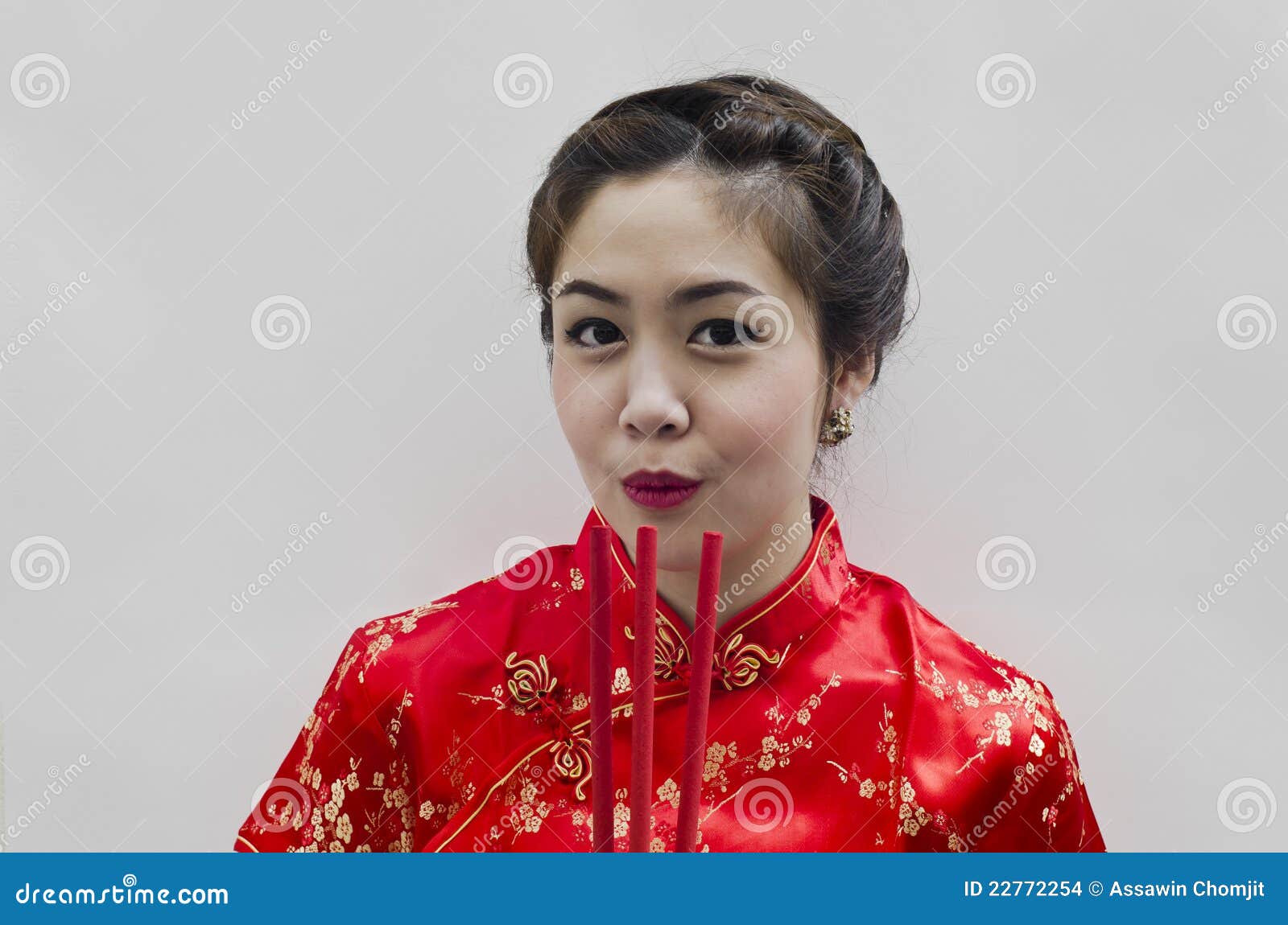 Chinese Woman Holding Joss Sticks Stock Photo - Image of pretty, beauty ...