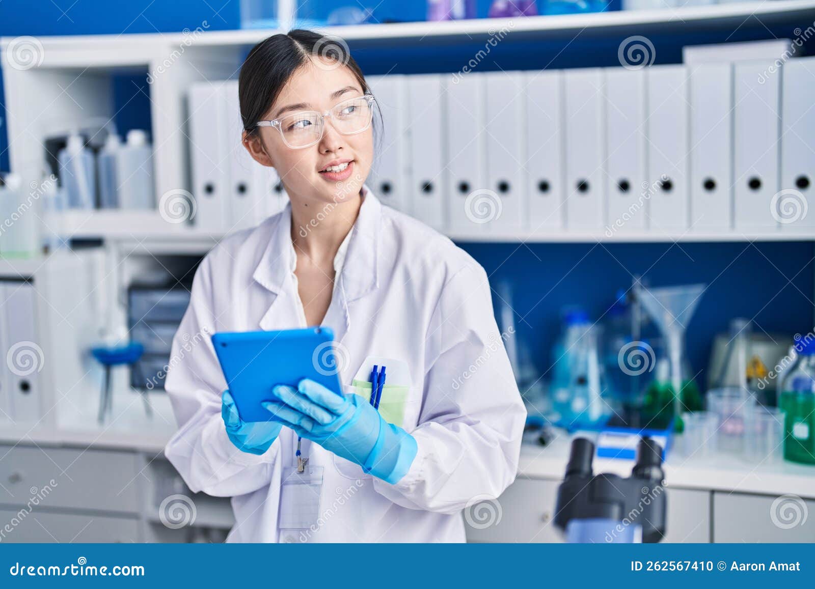Chinese Woman Scientist Using Touchpad Working at Laboratory Stock ...