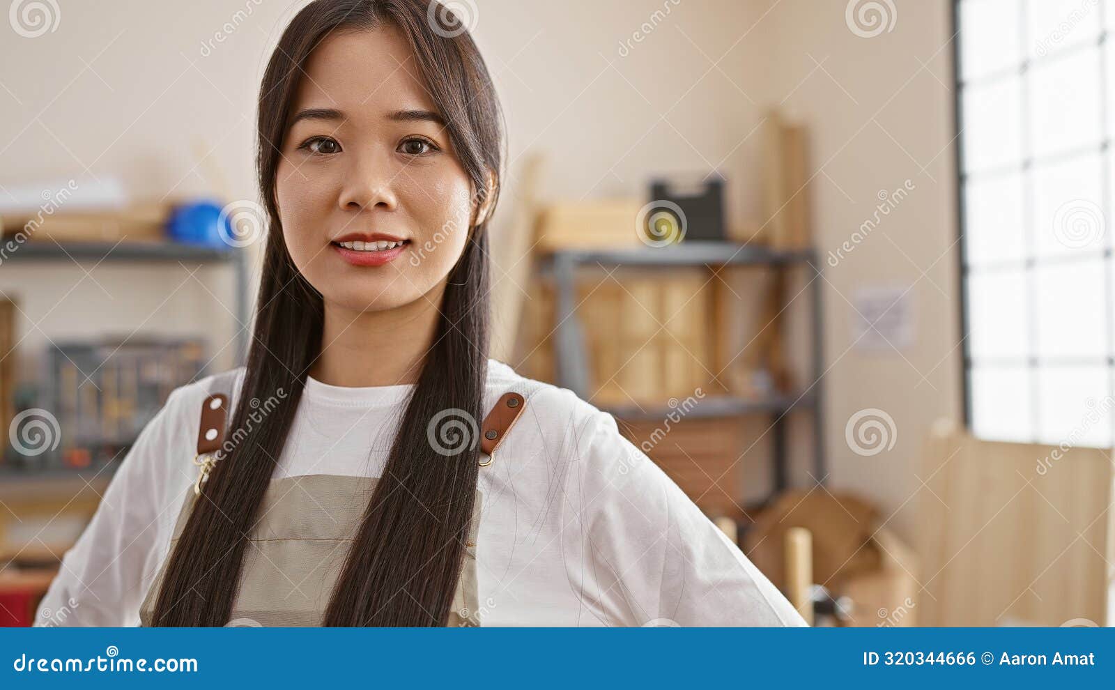 Chinese Woman Smiling in Carpentry Studio with Woodworking Tools in ...