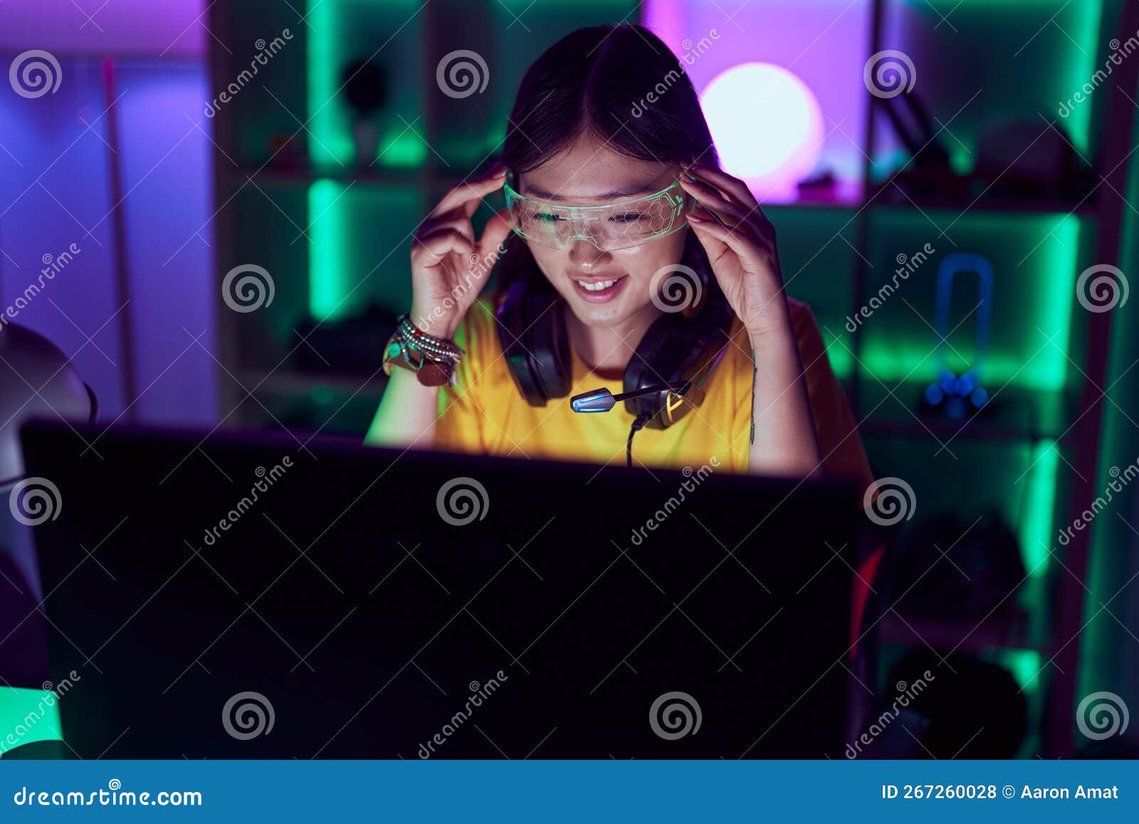 Chinese Woman Streamer Using Computer and Virtual Reality Glasses at ...
