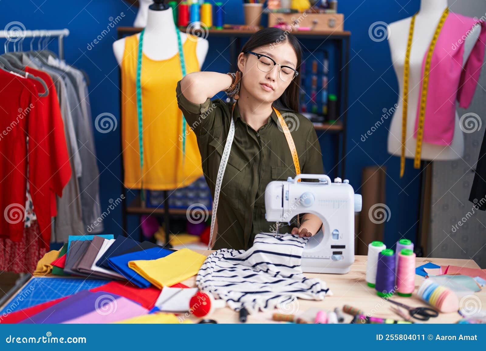 Chinese Woman Tailor Stressed Using Sewing Machine at Sewing Studio ...