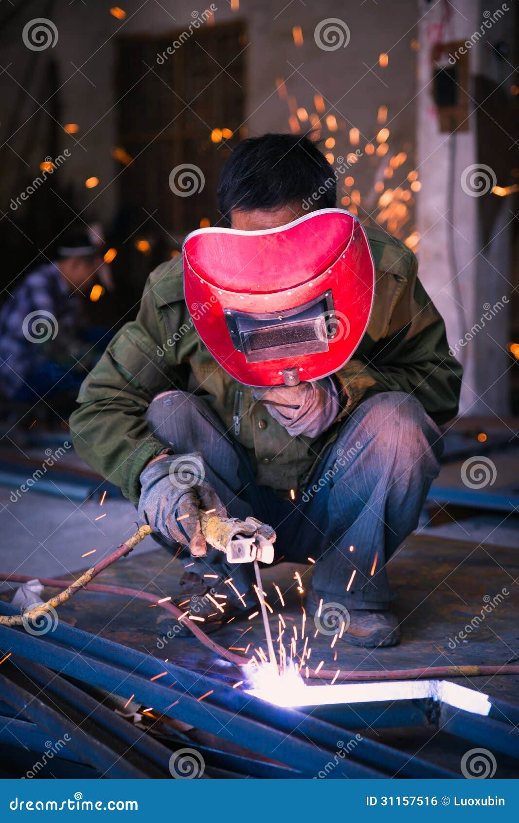 Chinese Worker Welding Metal Stock Photo - Image of asian, closeup ...